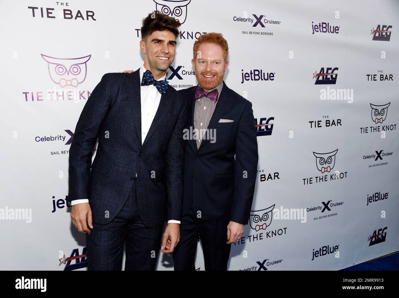 Actor Jesse Tyler Ferguson, right, and his husband Justin Mikita pose ...