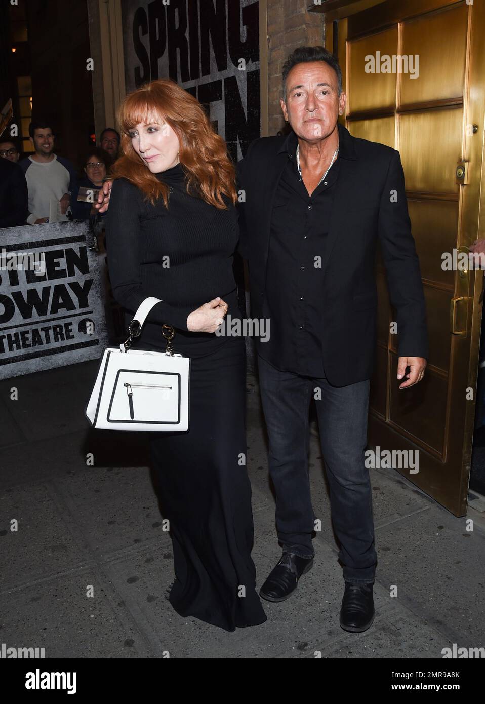 Musician Bruce Springsteen and his wife Patti Scialfa exit out the ...