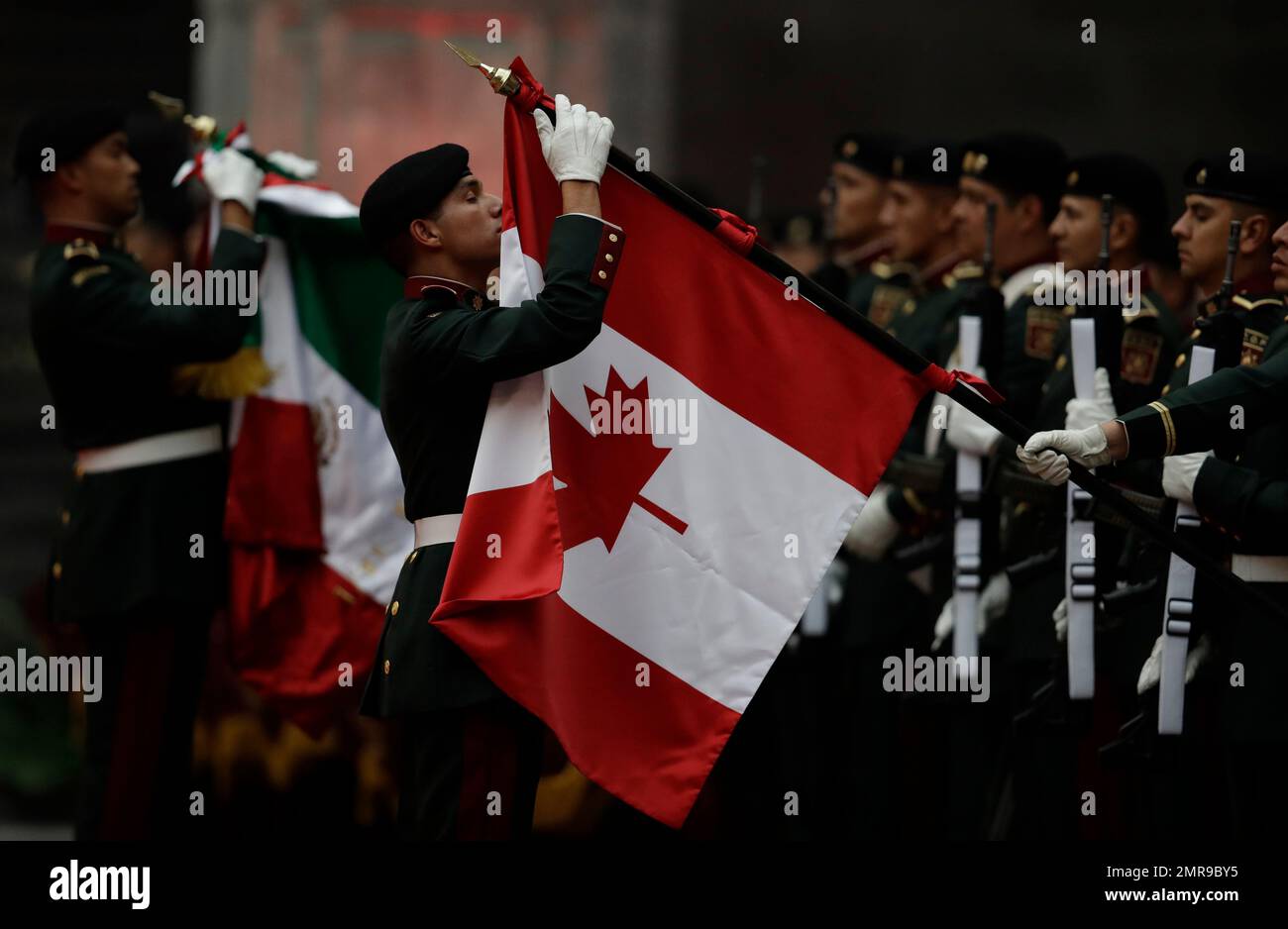 Mexican honor guards prepare for a welcoming ceremony for Canadian ...
