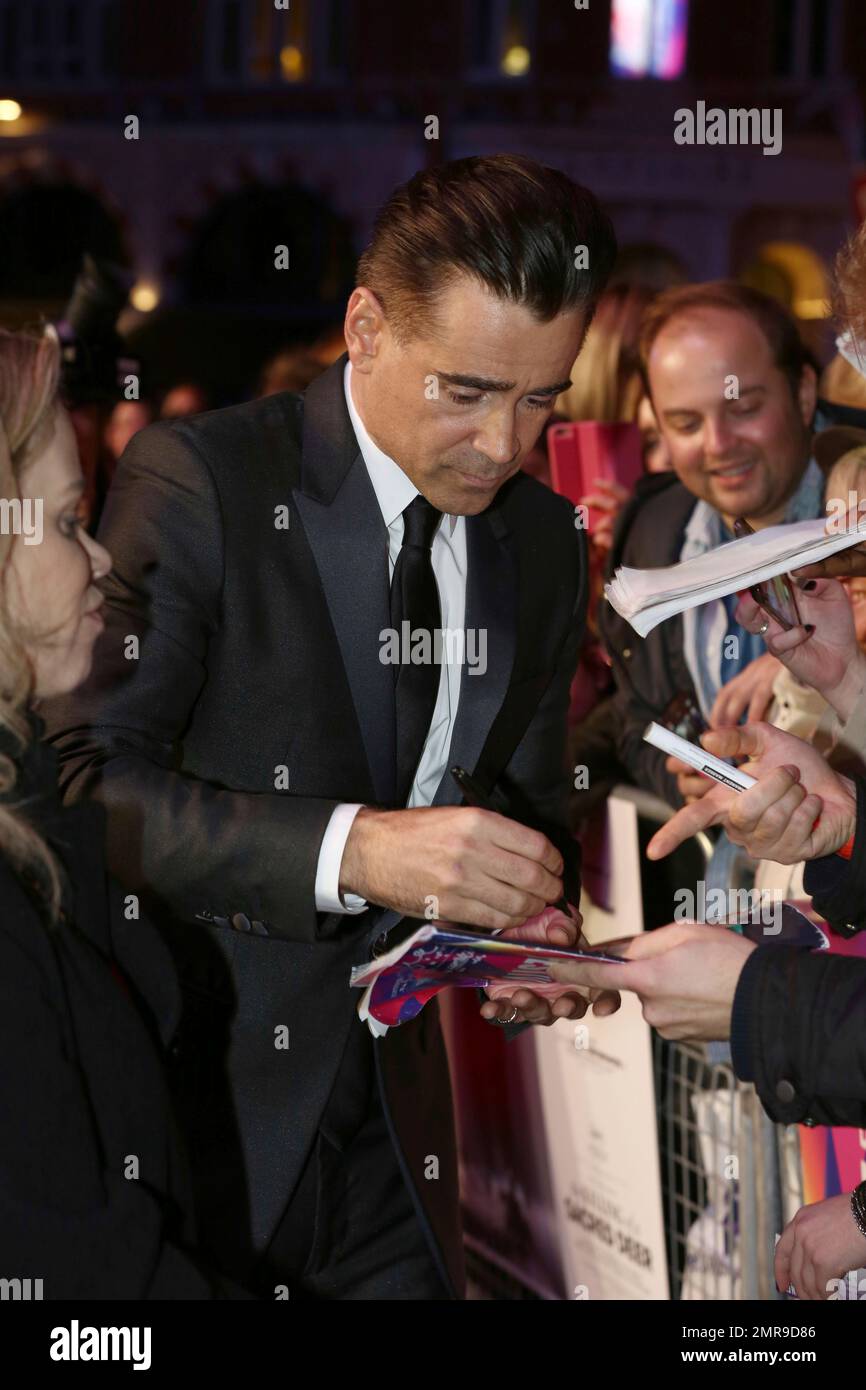 Actor Colin Farrell signs autographs for fans upon arrival at the ...