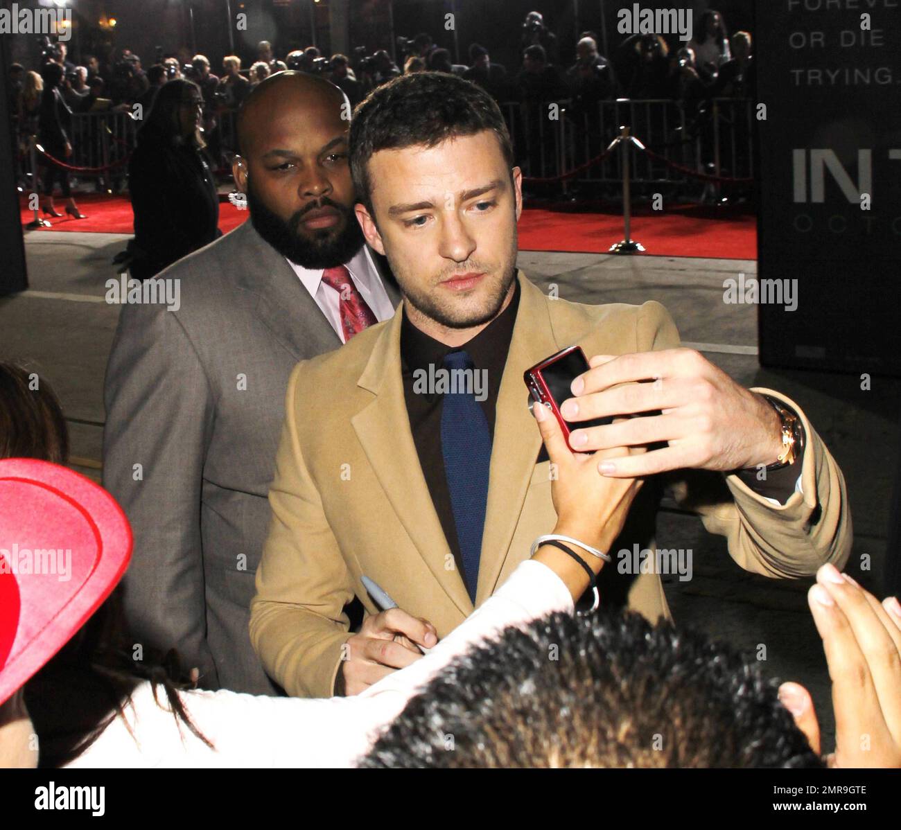 Justin Timberlake signs autographs at the Los Angeles Premiere of "In ...