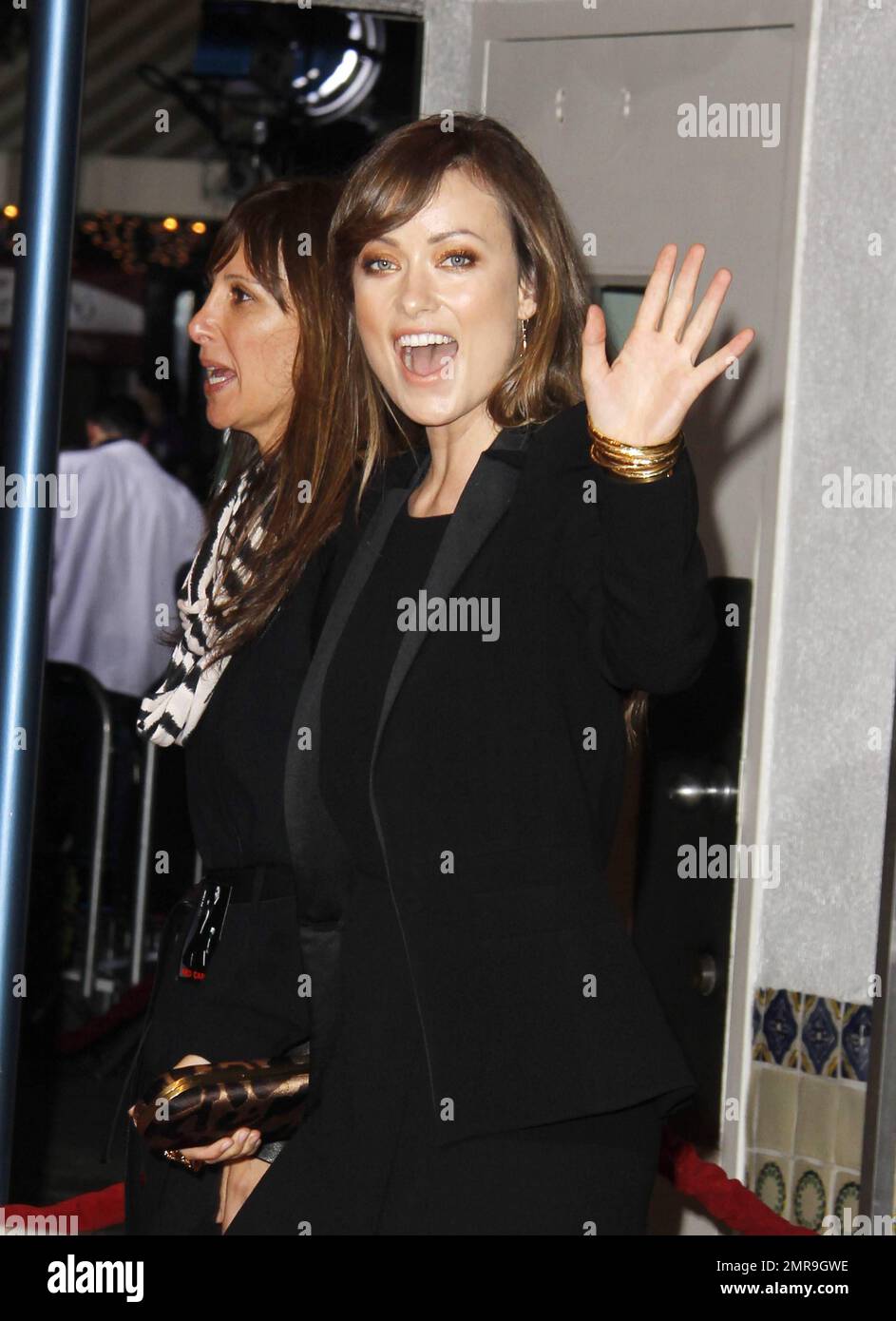Olivia Wilde waves as she arrives at the Los Angeles Premiere of "In ...