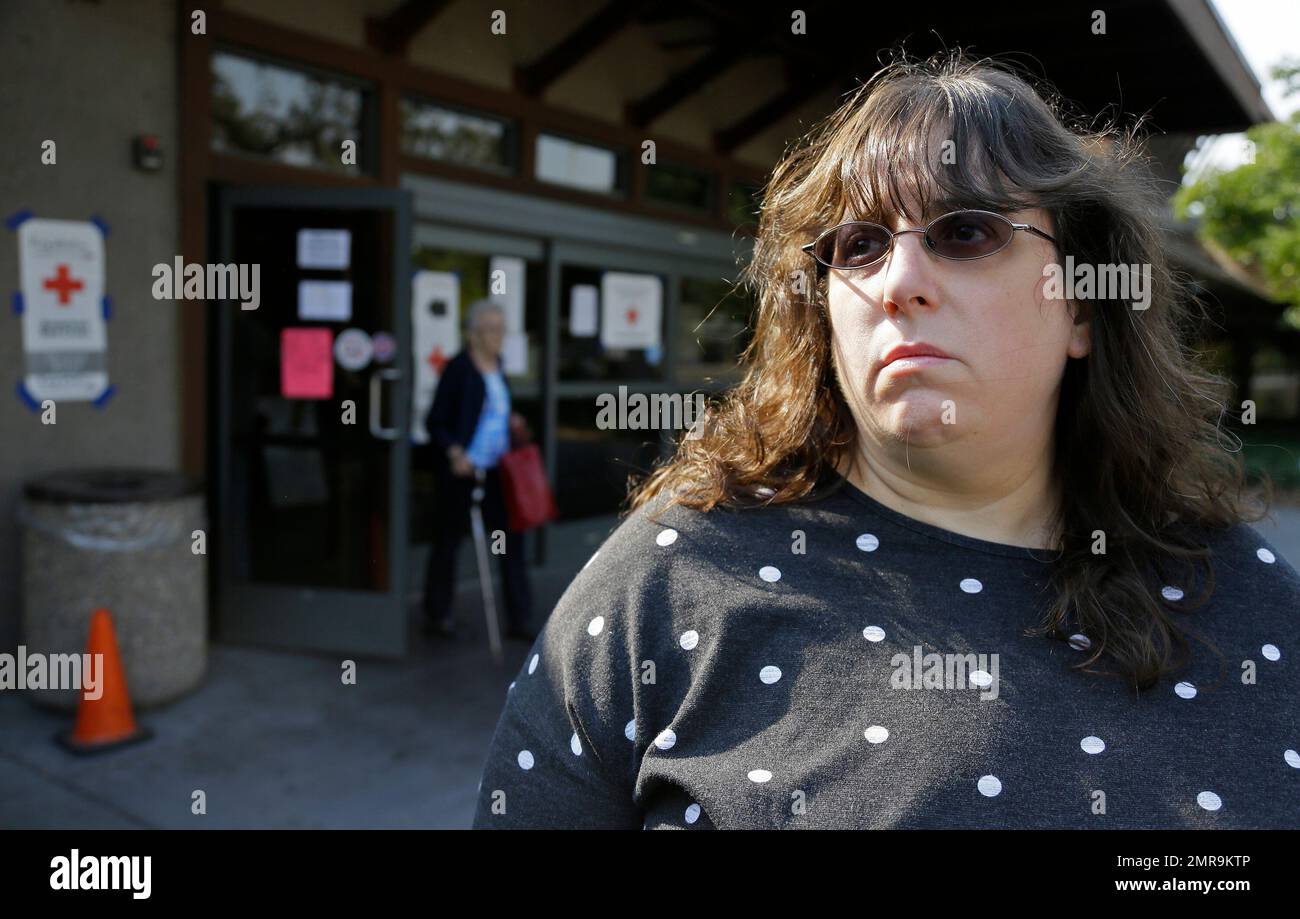 Jessica Tunis stands outside a Red Cross evacuation center Wednesday ...