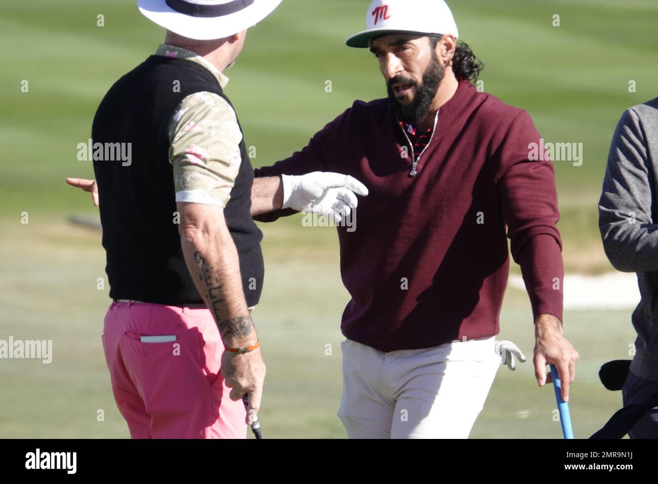 Pebble Beach, CA, USA. 31st Jan, 2023. Manolo Vega listens to advice ...