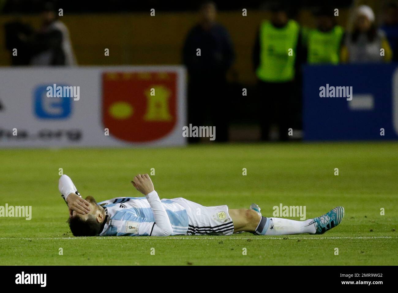 Argentina's Lionel Messi lies on the ground after a play against ...