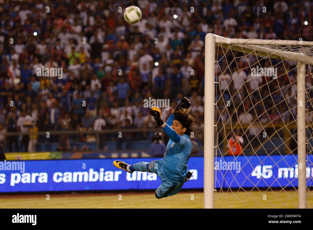 Mexico goalkeeper Guillermo Ochoa makes a save against Honduras during ...