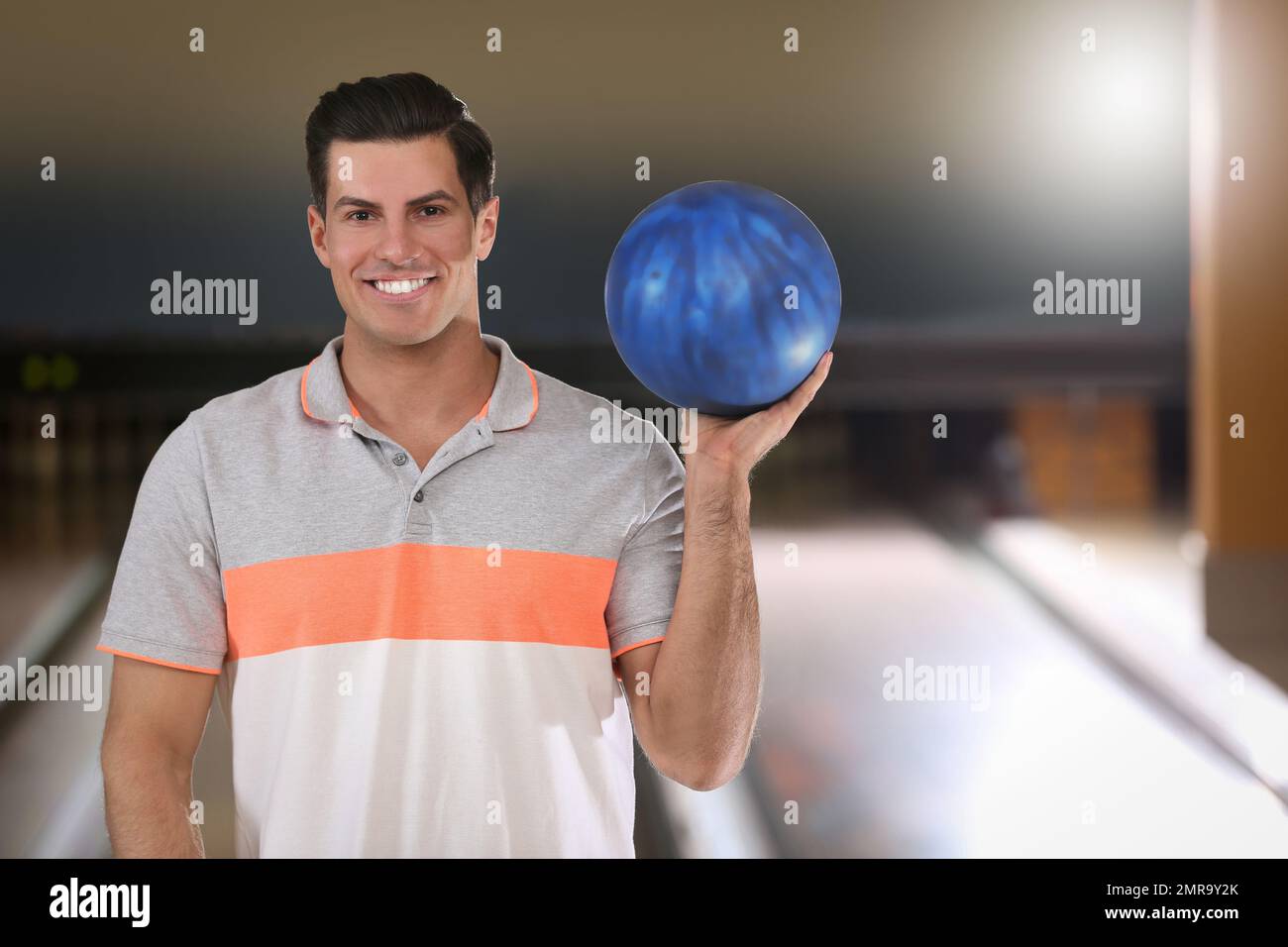 Man holding bowling ball in hi-res stock photography and images - Alamy