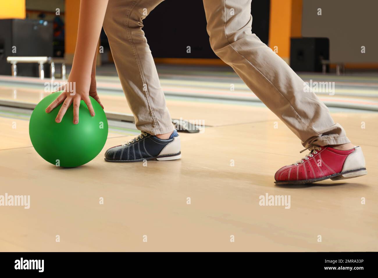 Little boy throwing ball in bowling club, closeup Stock Photo - Alamy