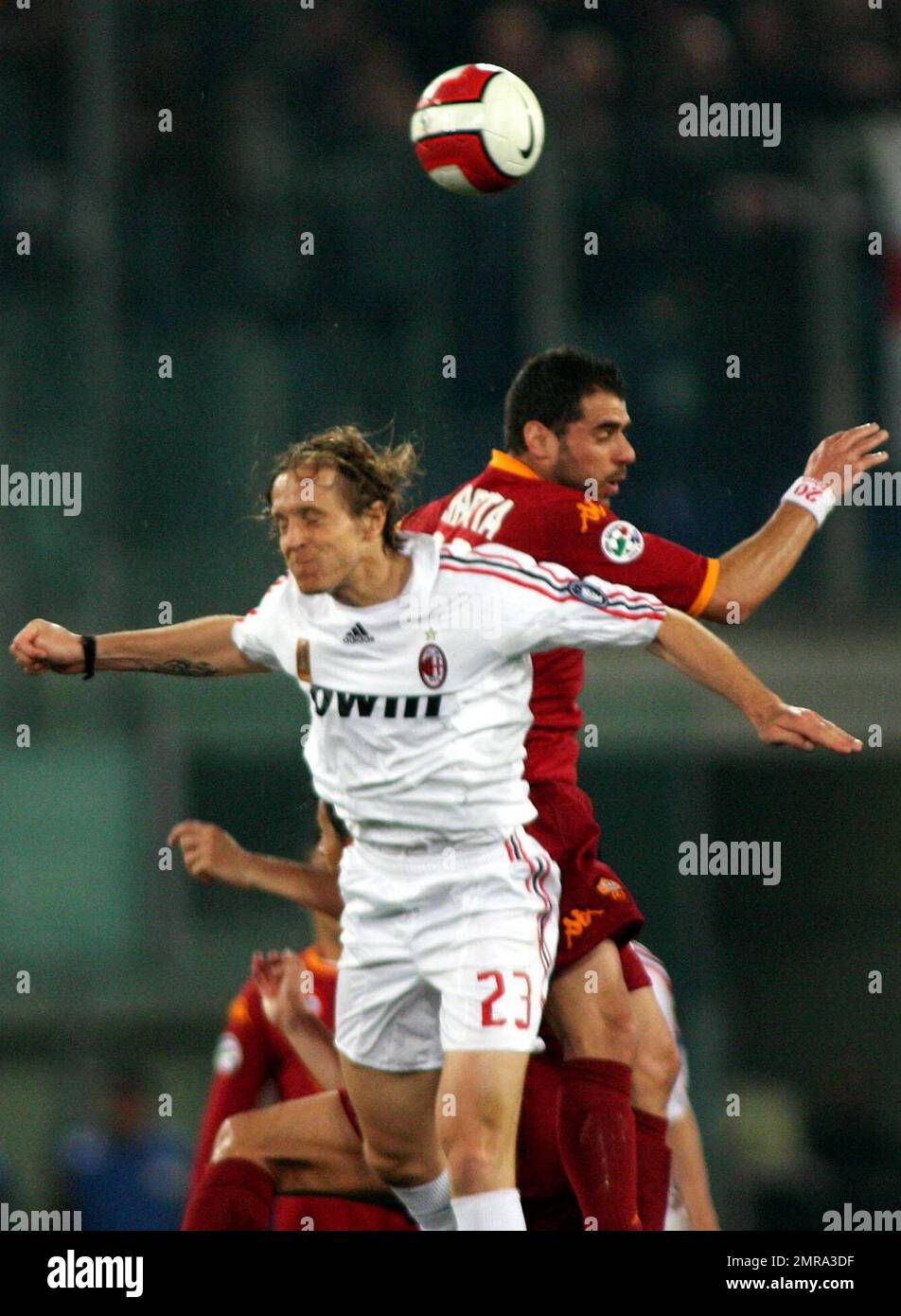 Simone Perrotta fights a ball with Ambrosini in the match Roma-Milan ...