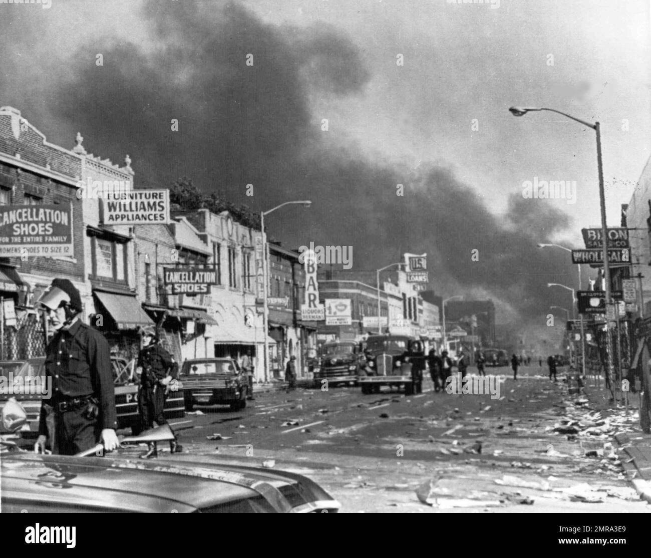 FILE - In this July 24, 1967 file photo Detroit police check buildings ...