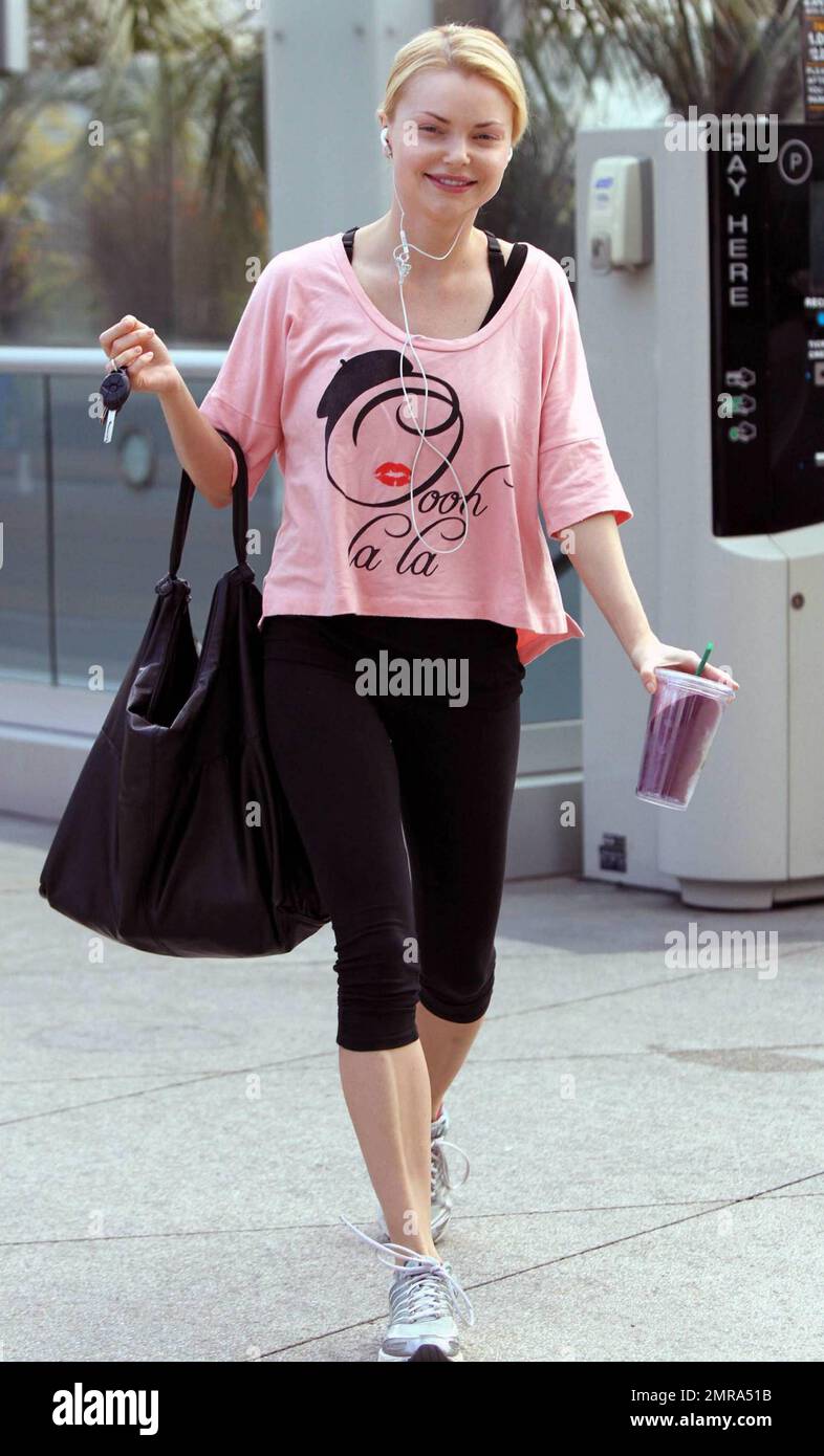 EXCLUSIVE!! Actress Izabella Miko wears a pink workout shirt that reads ...