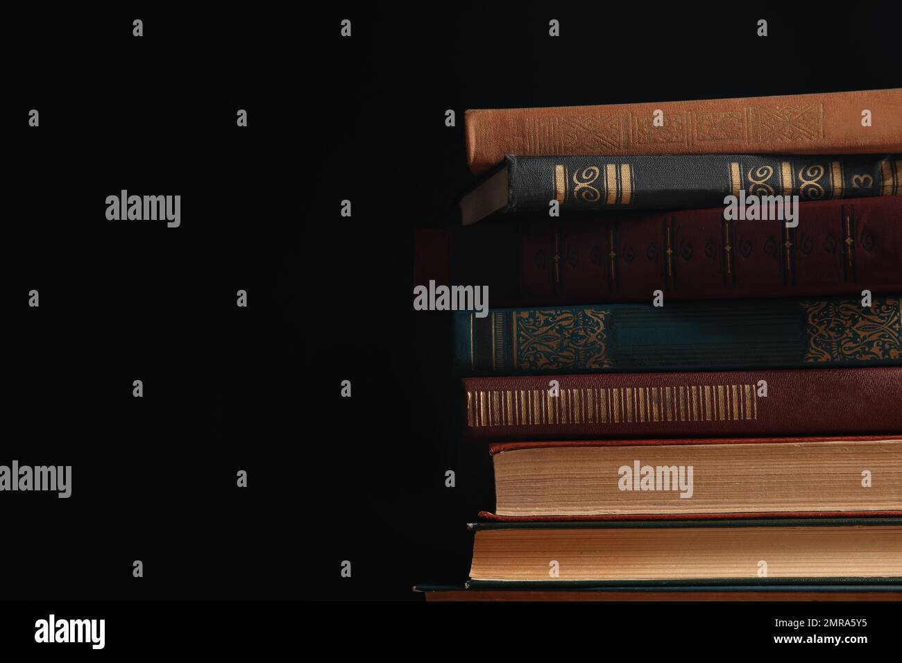 Collection of different books on dark background. Space for text Stock ...
