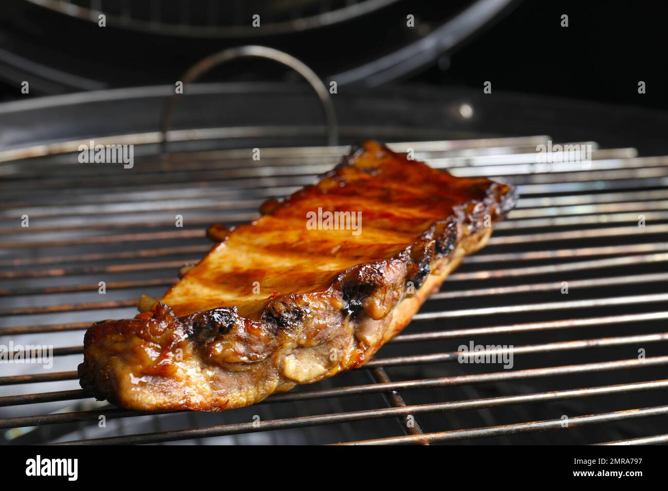 Delicious ribs on barbecue grill. Yummy meat Stock Photo - Alamy
