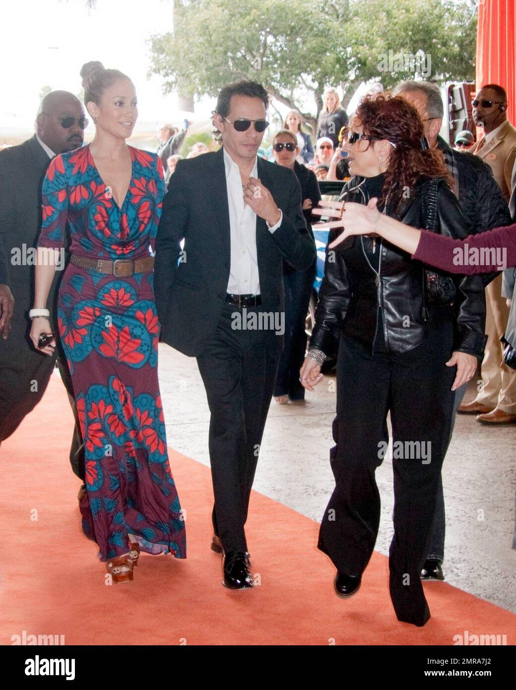 Jennifer Lopez and husband Marc Anthony walk the orange carpet with ...