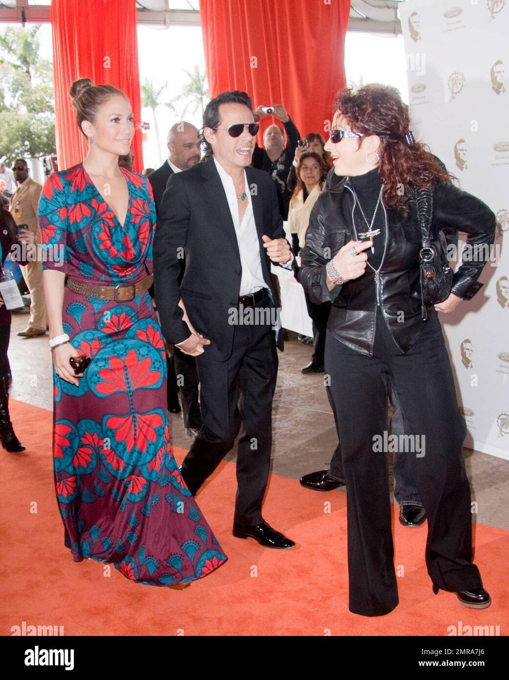 Jennifer Lopez and husband Marc Anthony walk the orange carpet with ...