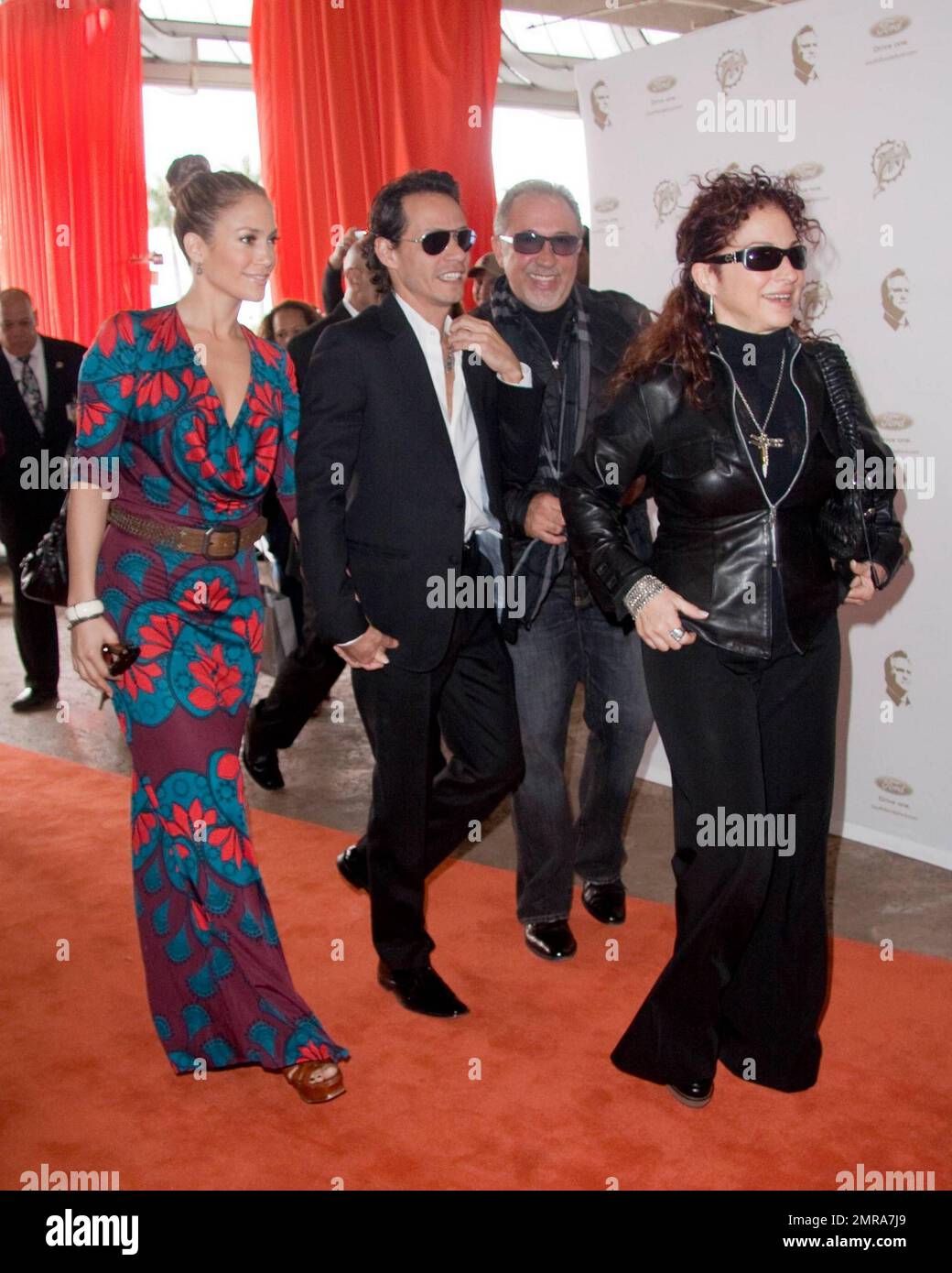 Jennifer Lopez and husband Marc Anthony walk the orange carpet with ...