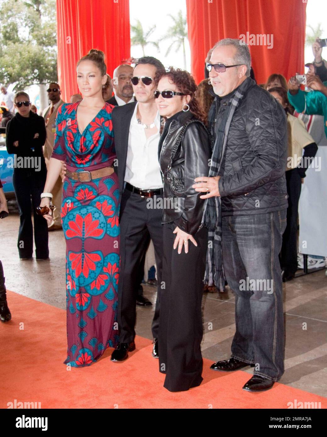 Jennifer Lopez and husband Marc Anthony walk the orange carpet with ...