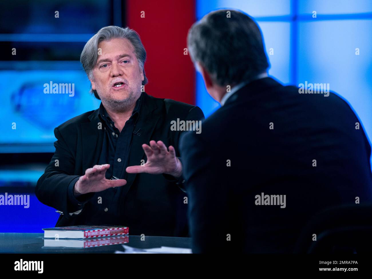 Former White House strategist Steve Bannon, left, takes part in an ...