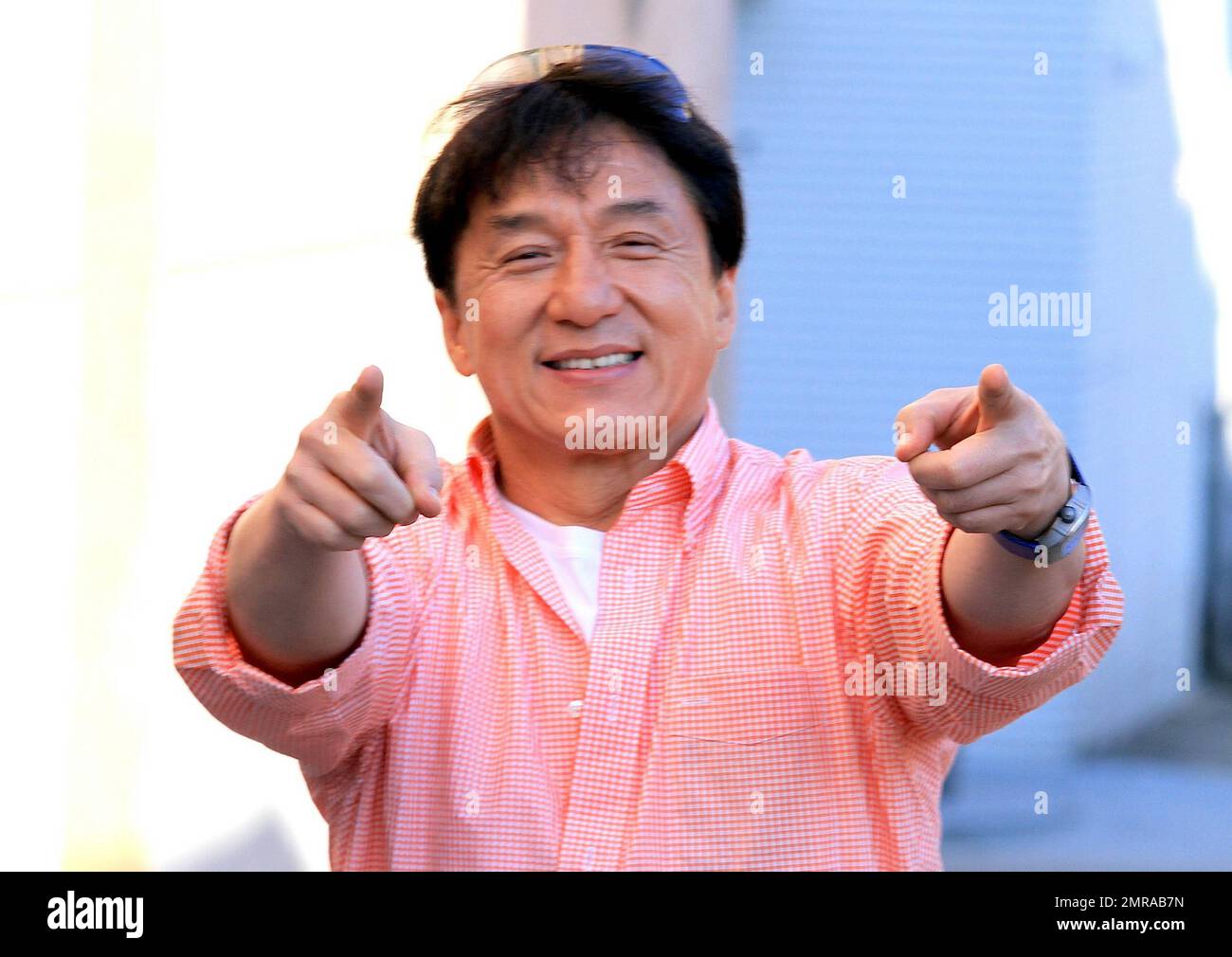 EXCLUSIVE!! Actor Jackie Chan flashes a peace sign and smiles while out ...