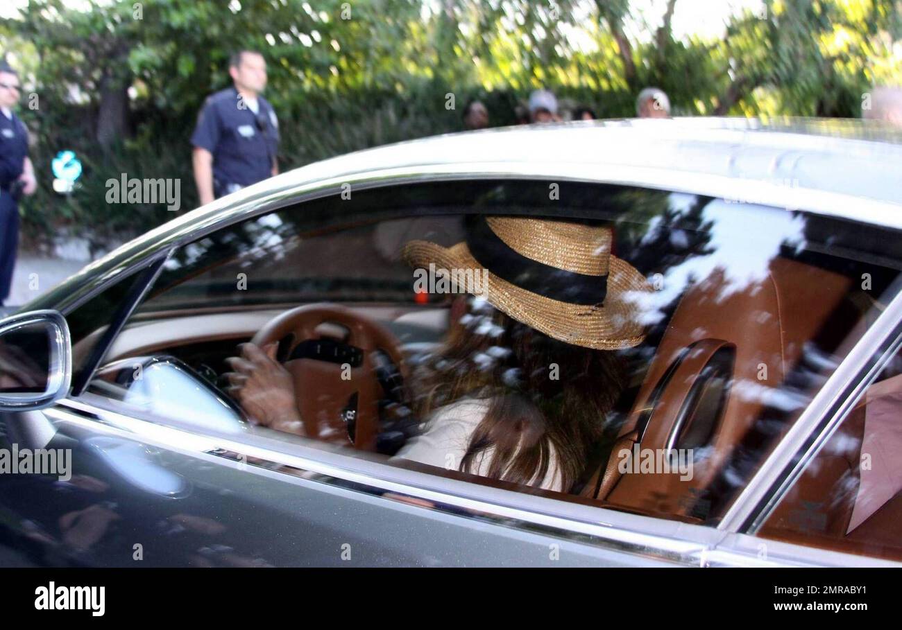 Fans and friends gather outside the Jackson family compound to leave ...