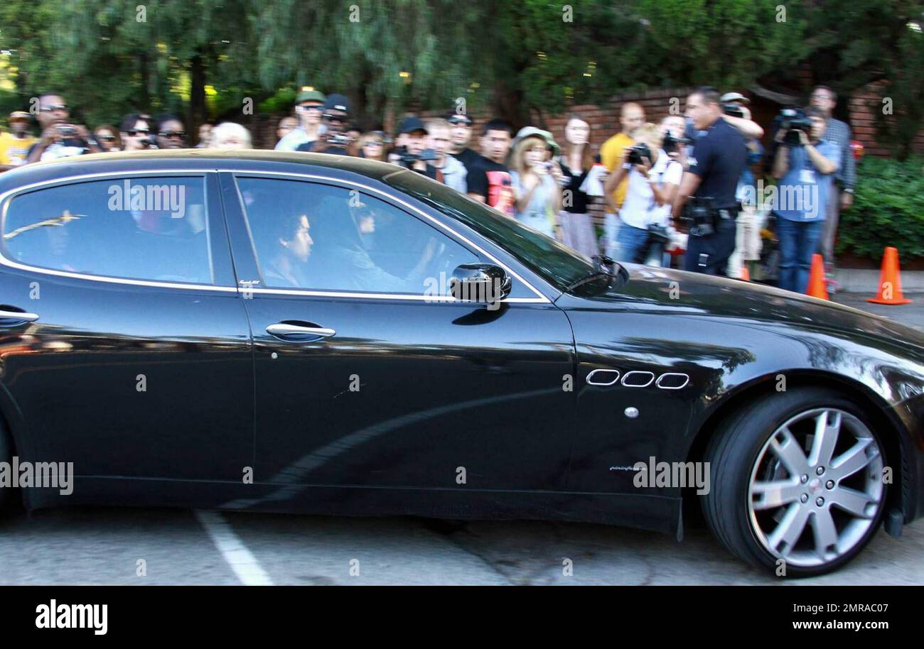 Fans and friends gather outside the Jackson family compound to leave ...