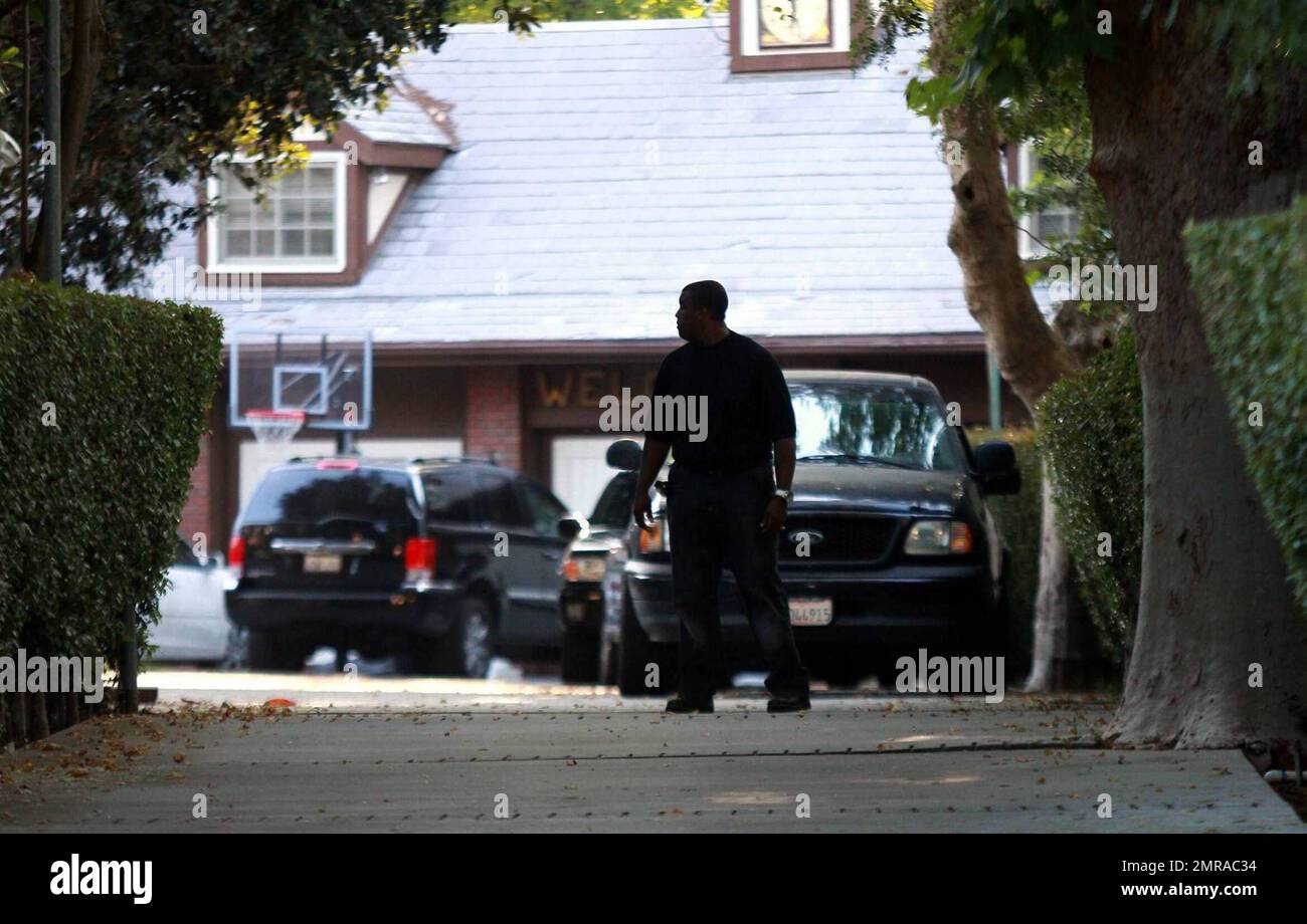 Fans and friends gather outside the Jackson family compound to leave ...