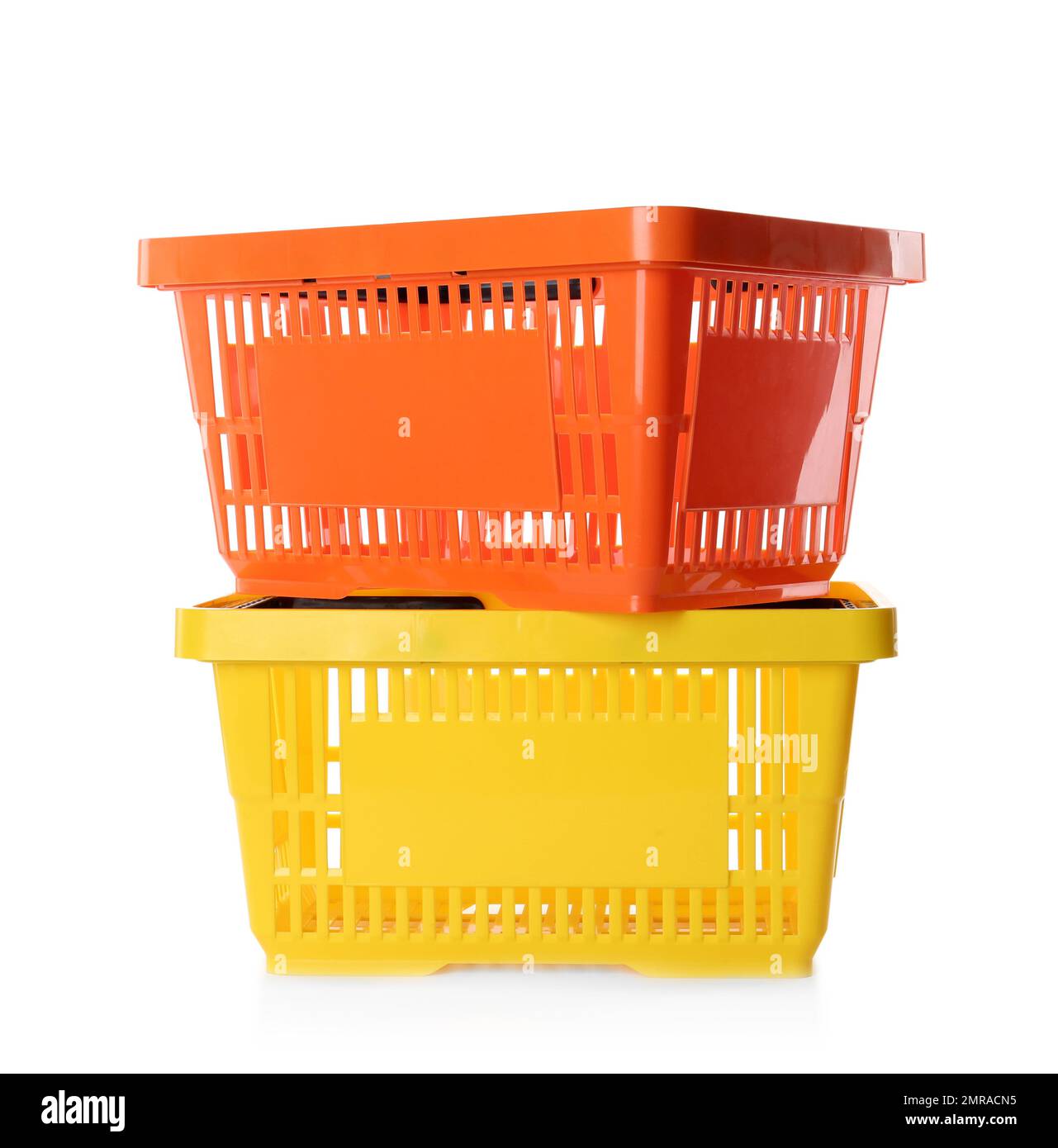 Color plastic shopping baskets isolated on white Stock Photo - Alamy