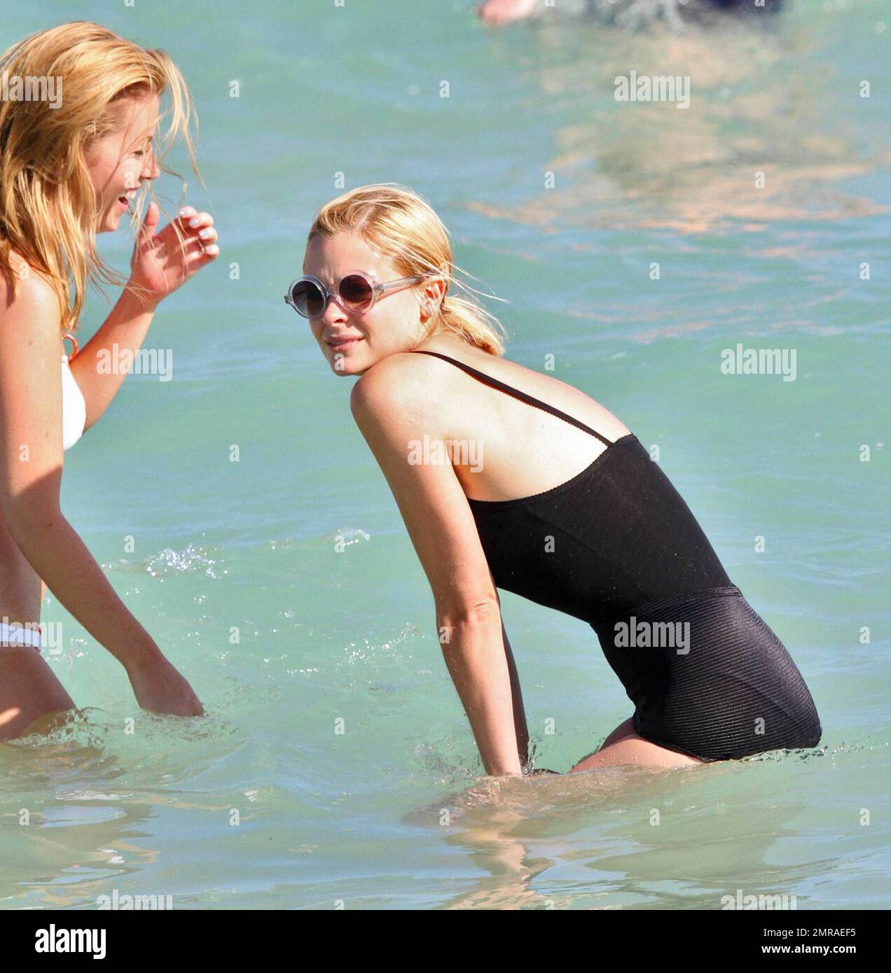 Actress and model Jaime King shows off her incredible figure in a vintage-style black one piece ...