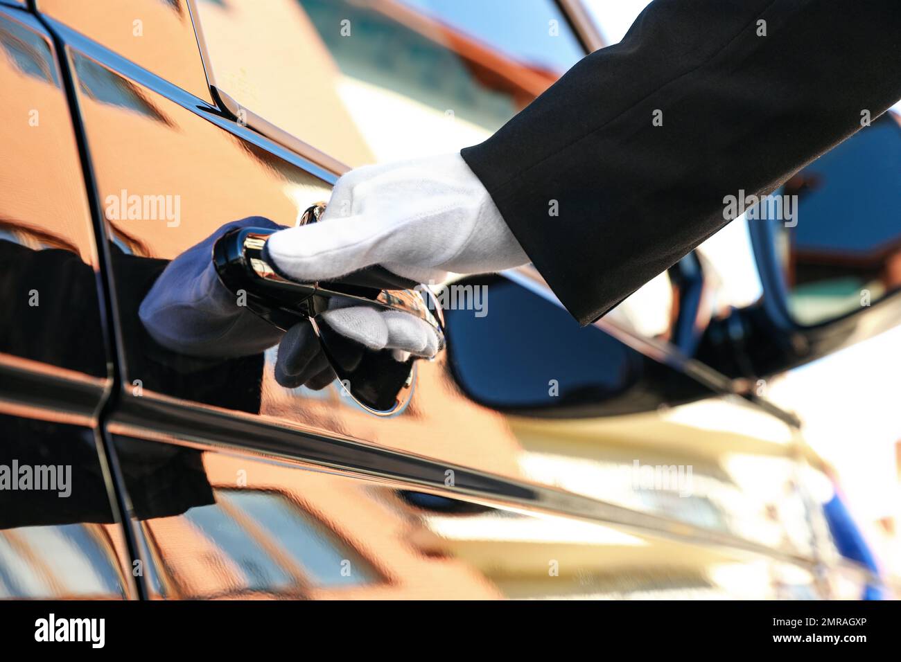 Opening car door gloves hi-res stock photography and images - Alamy
