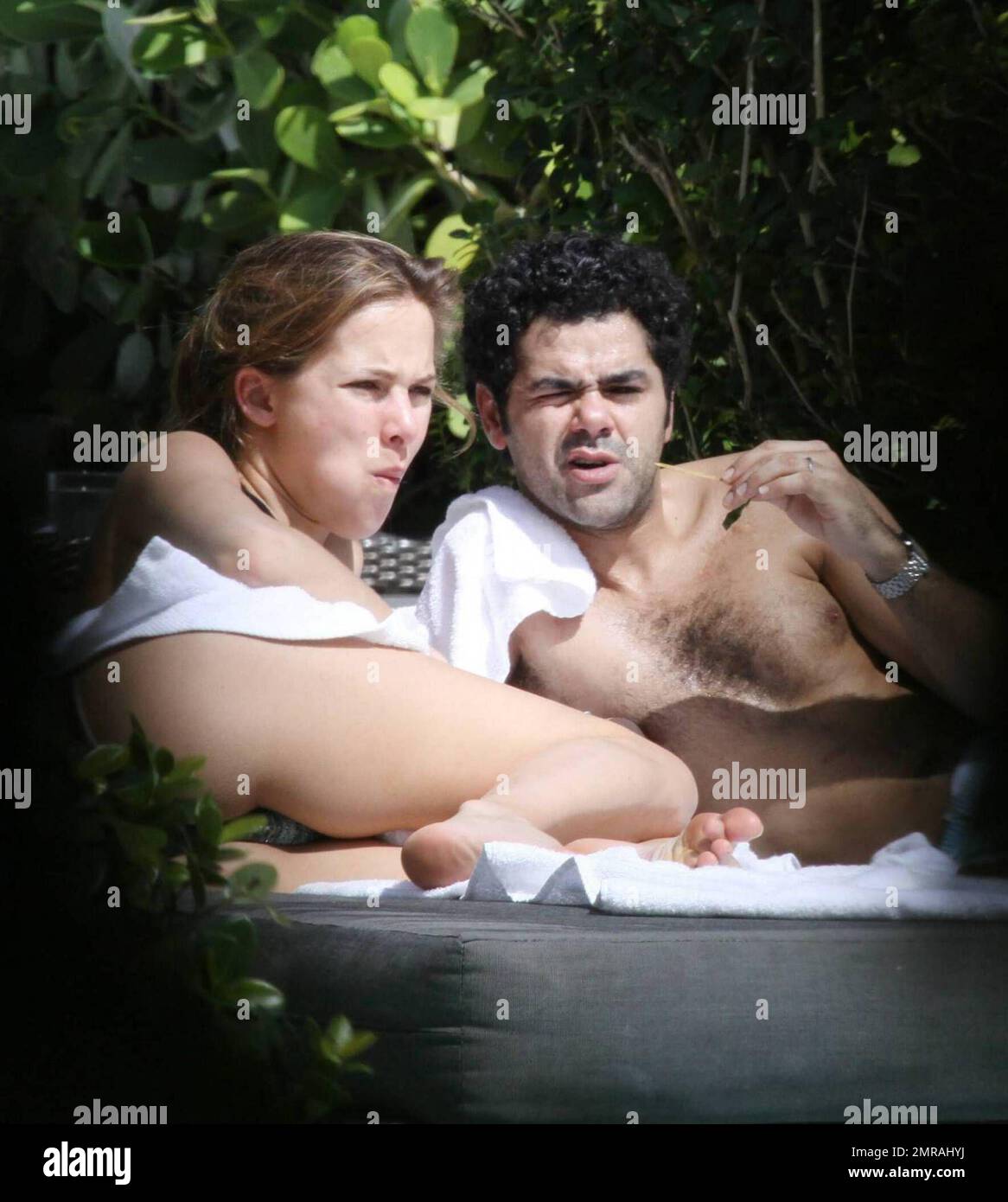 French actor Jamel Debbouze and wife Melissa Theuriau enjoy a day in the sun wearing bathing ...