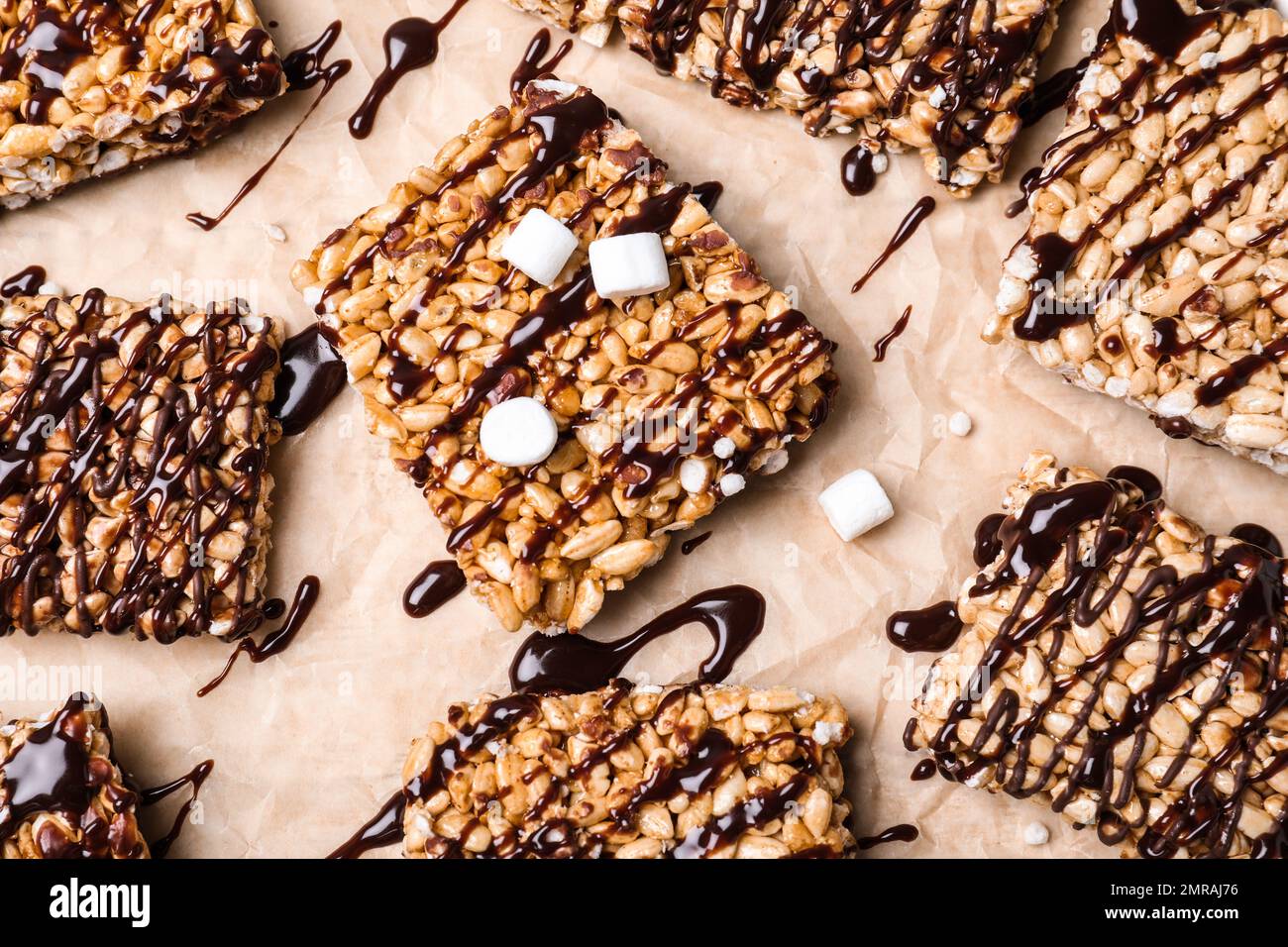 Delicious rice crispy treats on parchment paper, flat lay Stock Photo ...