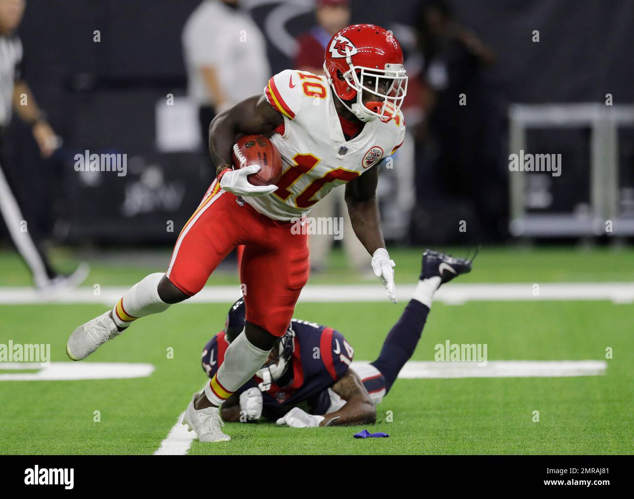 Kansas City Chiefs wide receiver Tyreek Hill (10) tries to evade to ...
