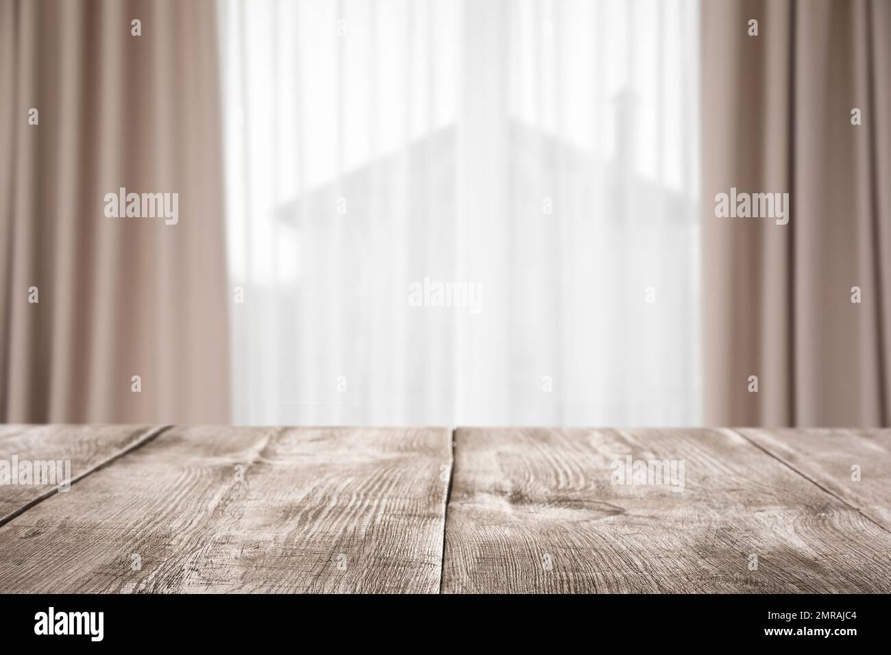 Empty wooden table in room. Space for design Stock Photo - Alamy