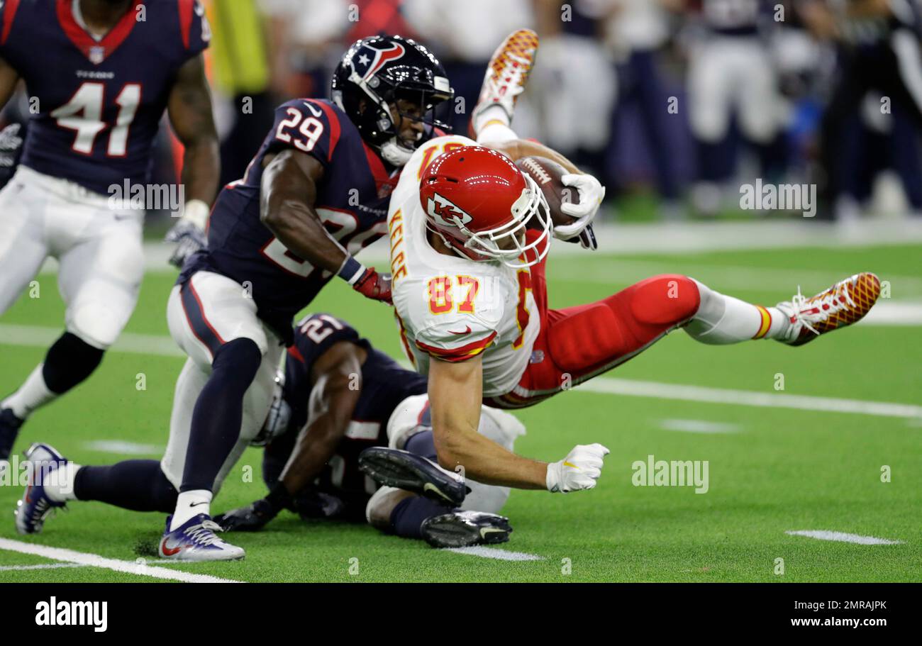 Kansas City Chiefs tight end Travis Kelce (87) is hit by Houston Texans ...