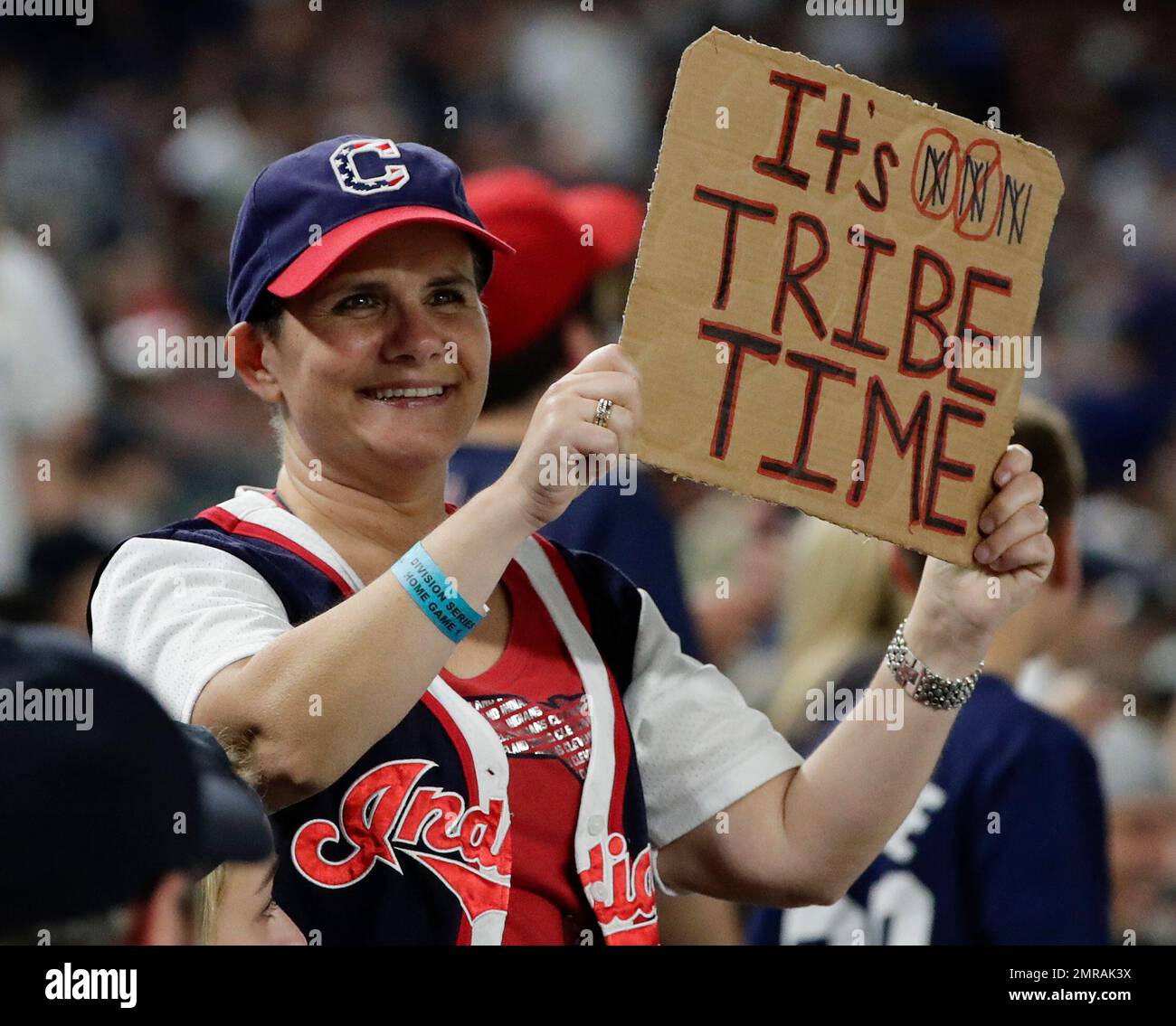A Cleveland Indians fan hold up a sign during the fourth inning in Game ...