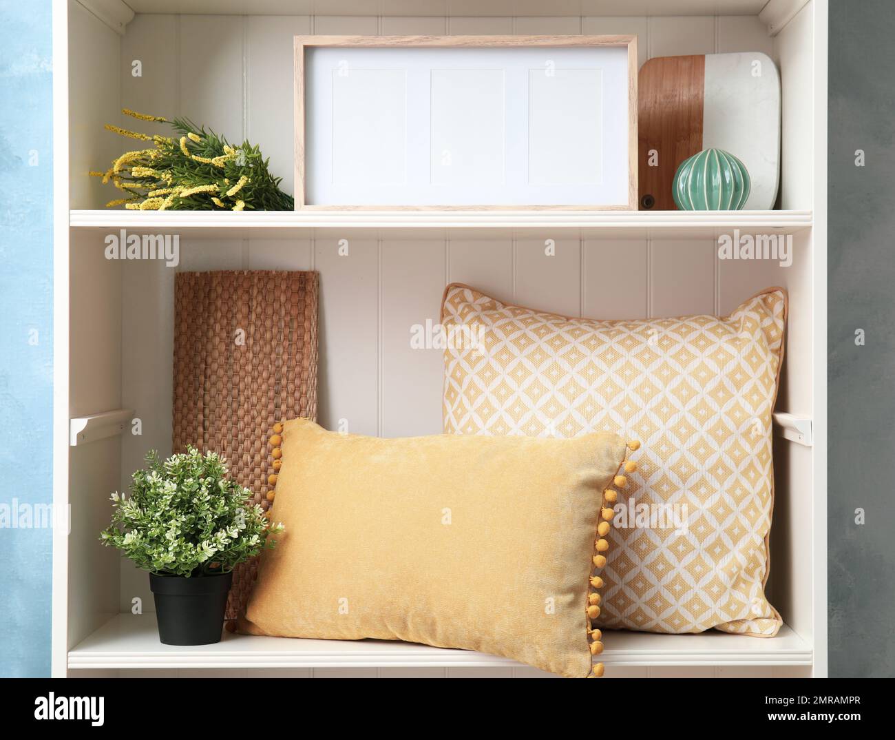 White shelving unit with different decorative stuff Stock Photo - Alamy