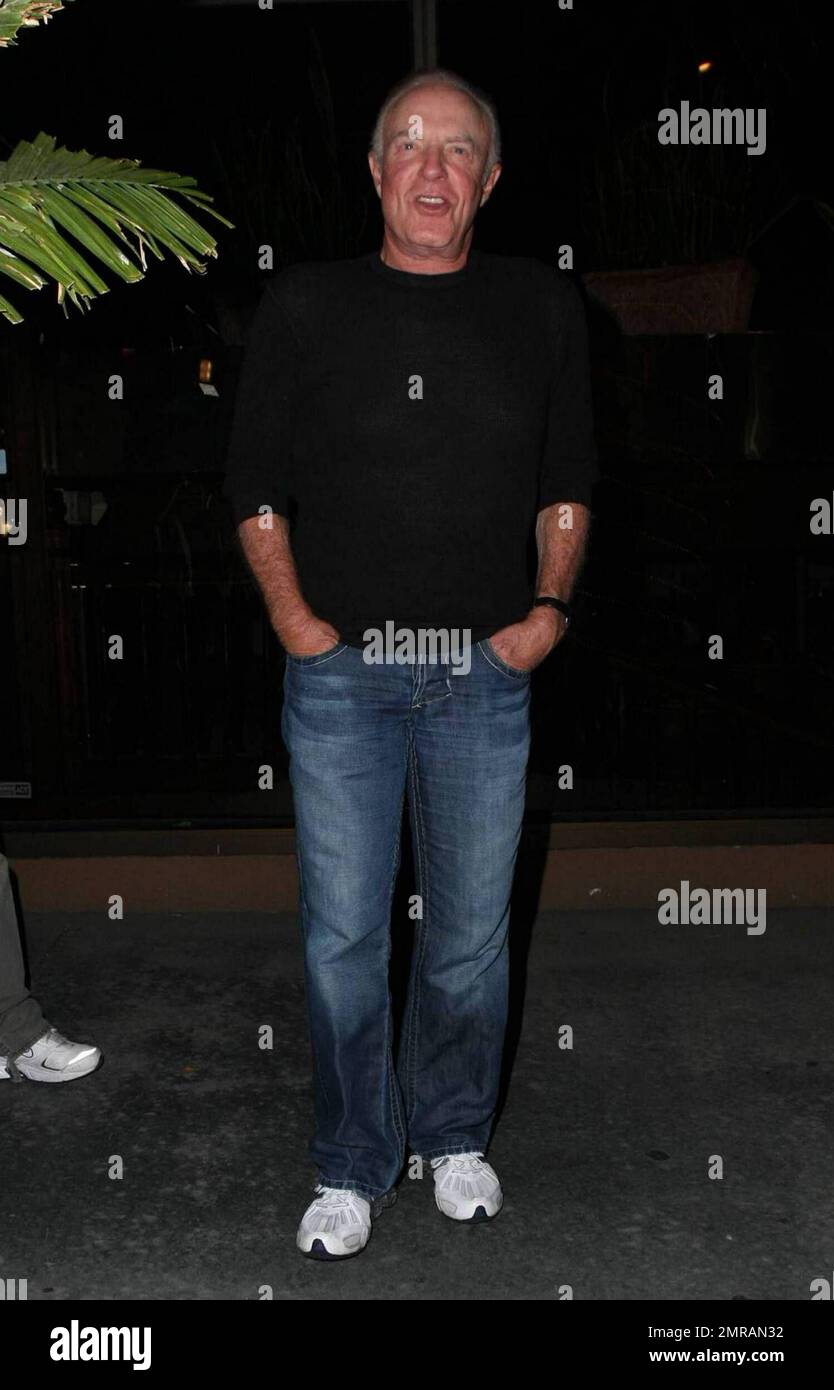 Actor James Caan smiles for the cameras as he leaves the restaurant ...