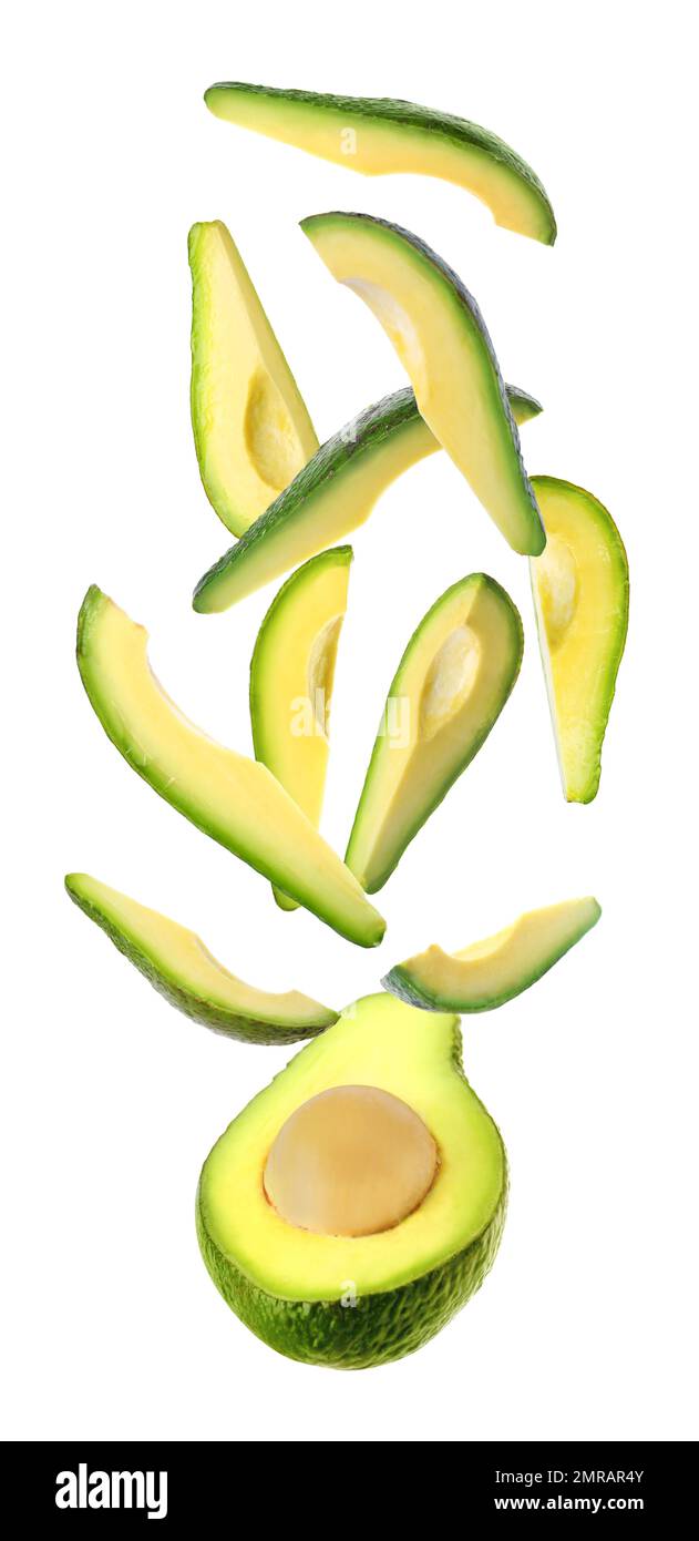Flying delicious fresh avocados on white background Stock Photo - Alamy