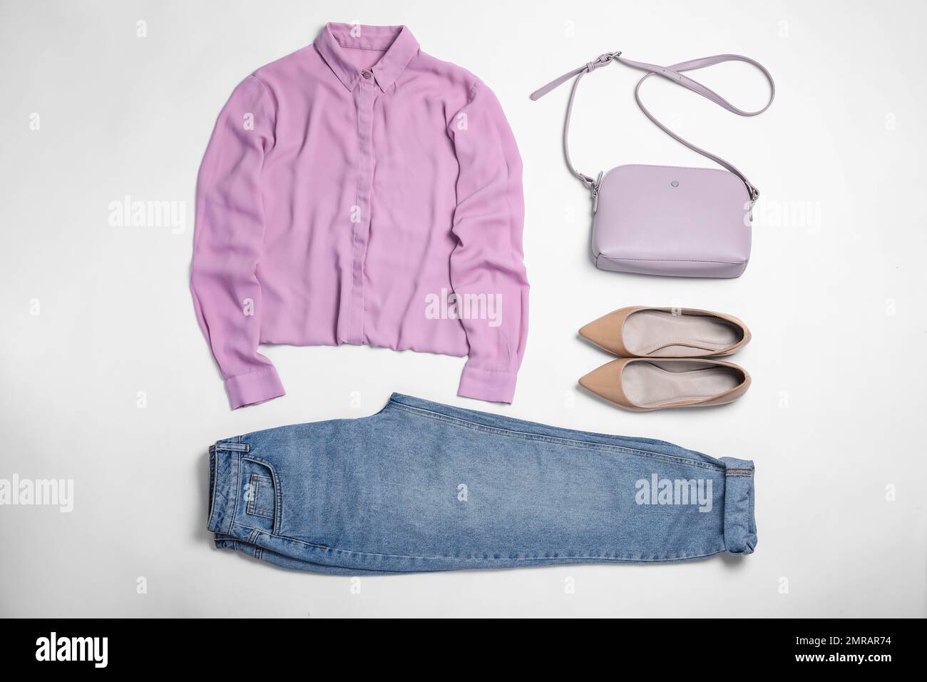Stylish outfit with jeans on white background, top view Stock Photo - Alamy