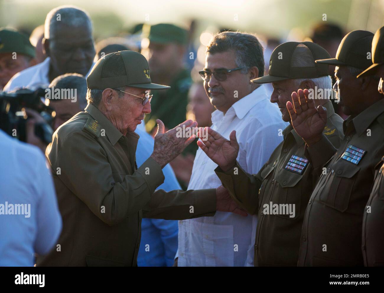 Cuba's President Raul Castro, left, salutes military officers before an ...