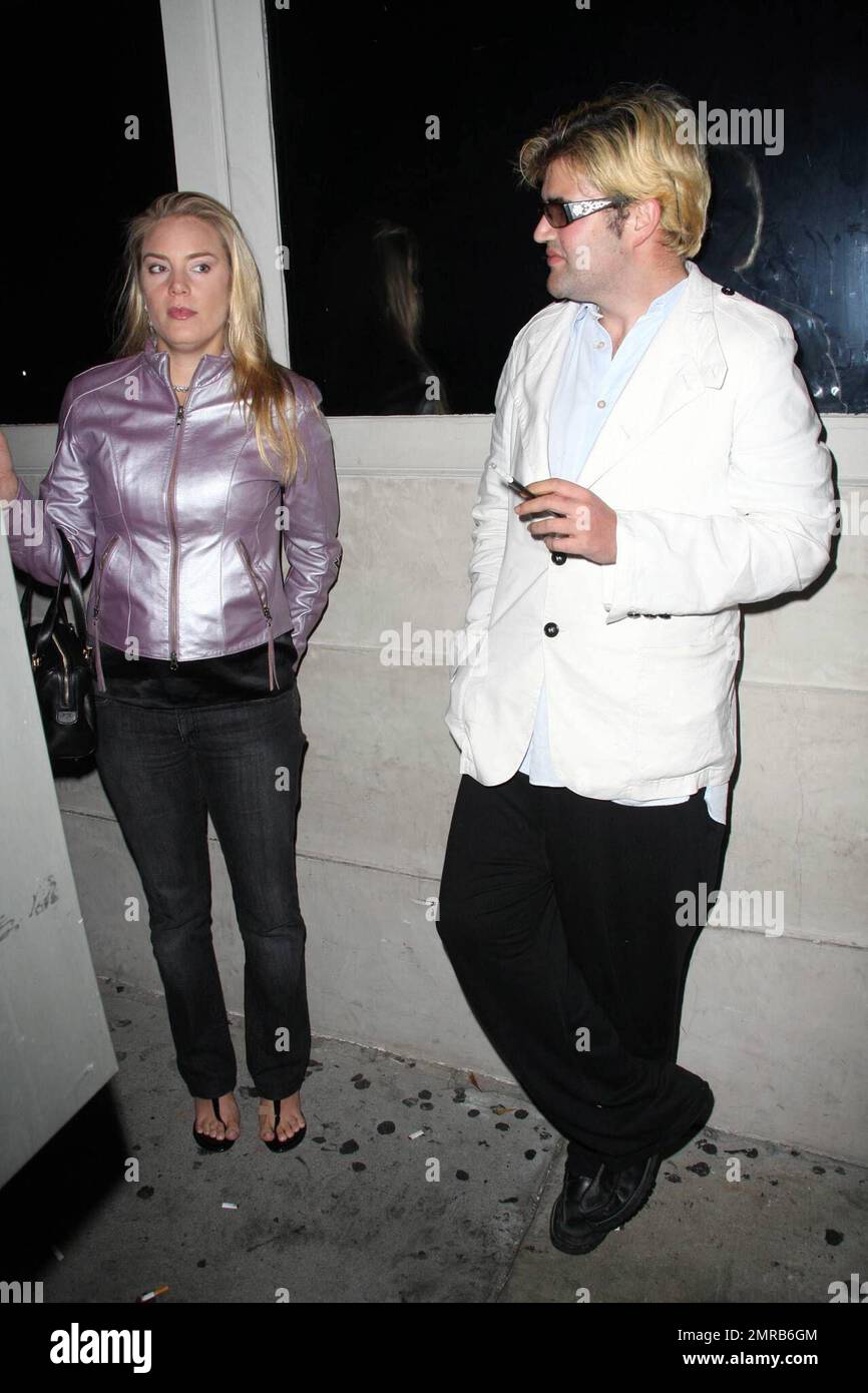 Outside the nightclub Villa with a friend, Jason Davis smokes a ...