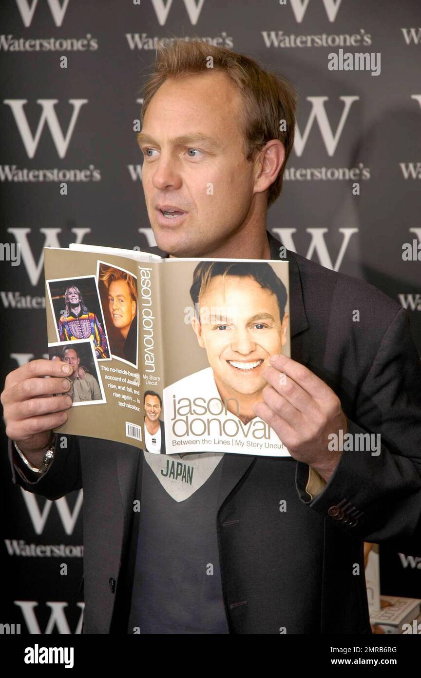 Pop singer and former "Neighbours" star Jason Donovan signs copies of ...