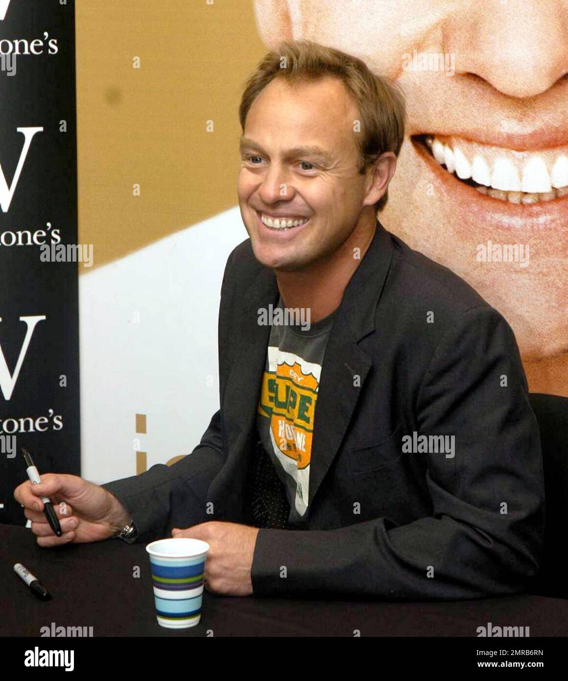 Pop singer and former "Neighbours" star Jason Donovan signs copies of ...