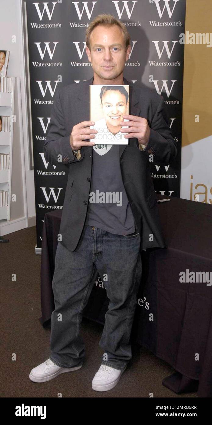 Pop singer and former "Neighbours" star Jason Donovan signs copies of ...