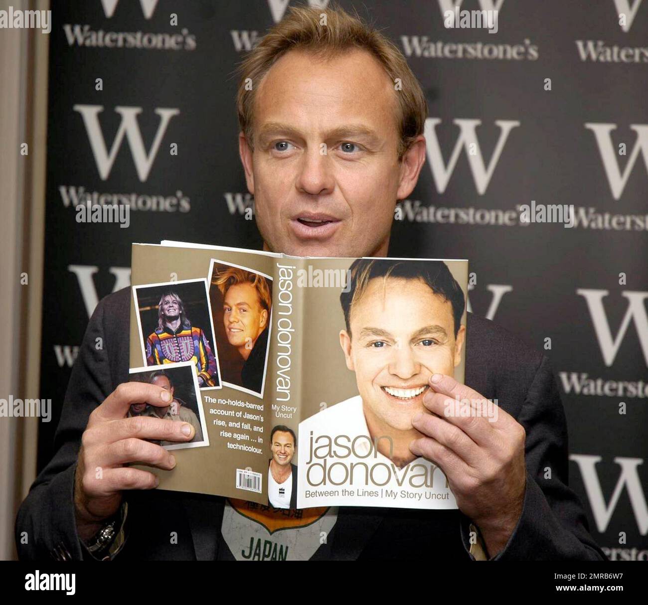 Pop singer and former "Neighbours" star Jason Donovan signs copies of his new book "Between the ...