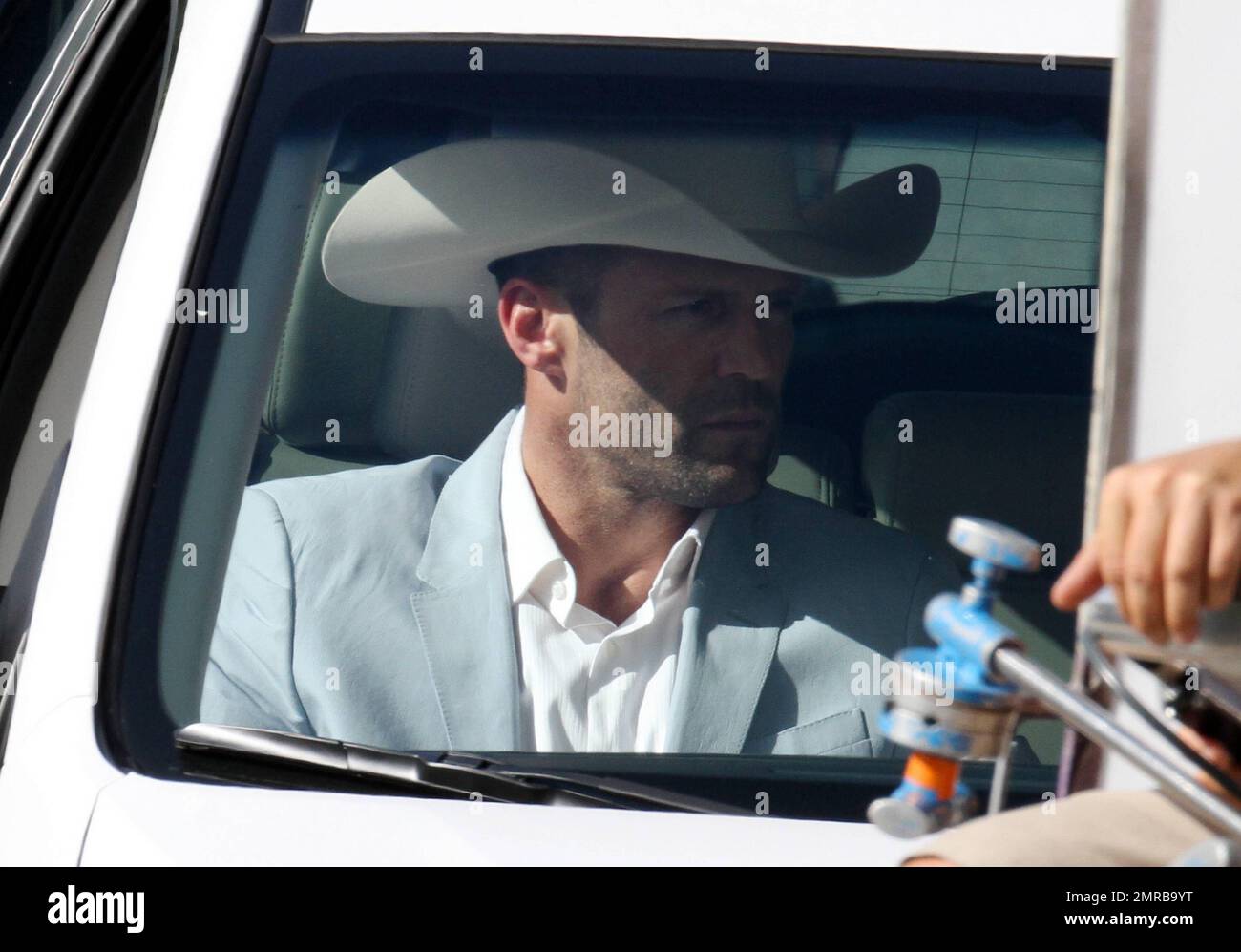 Jason Statham wears country western wear, complete with cowboy hat and ...