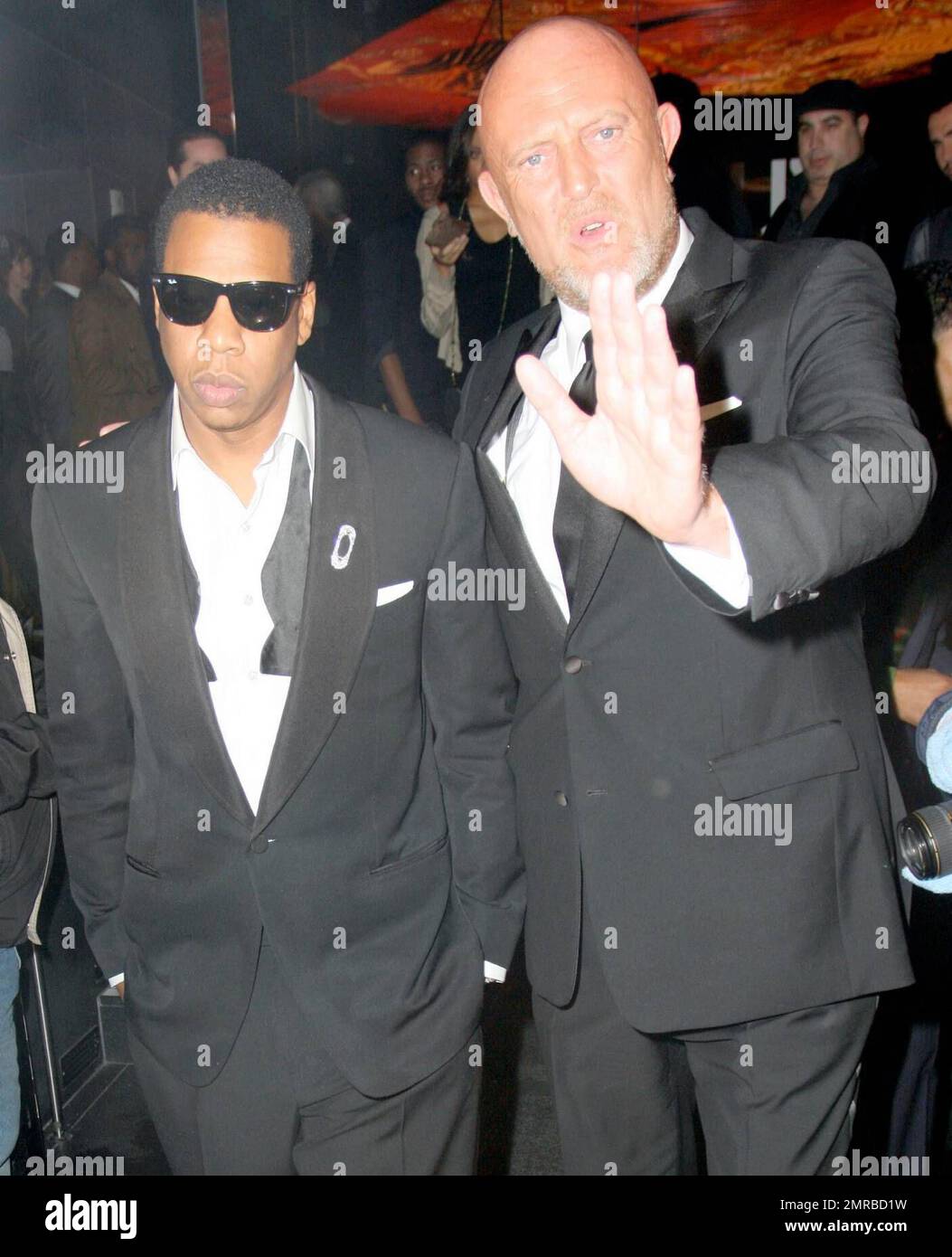 Jay-Z, escorted by a bodyguard and without wife Beyonce Knowles, spends ...