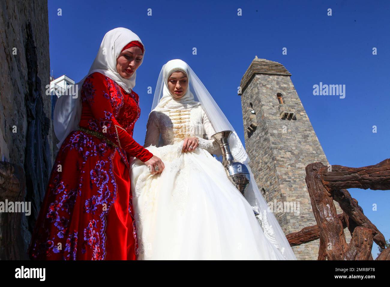 Chechen women dressed in national clothes attend a mass wedding ...