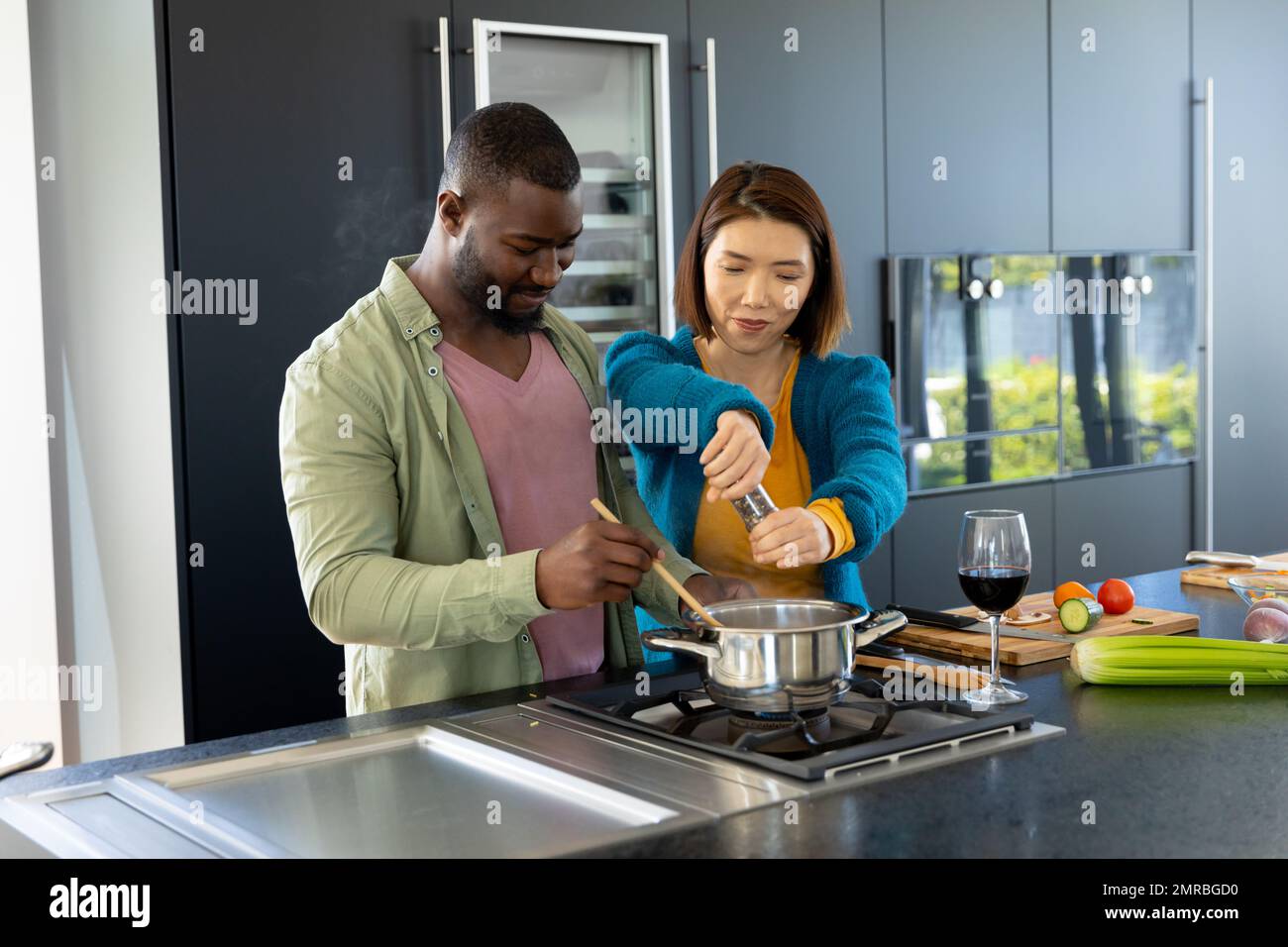 Happy family cooking together modern hi-res stock photography and ...