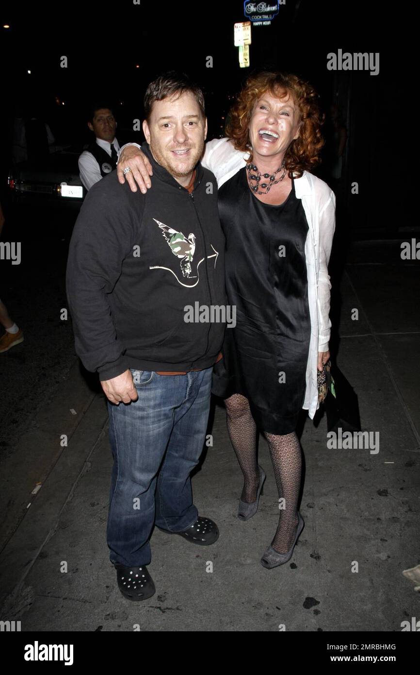 Jeff Richards turns a video camera around on the crowd of photographers ...